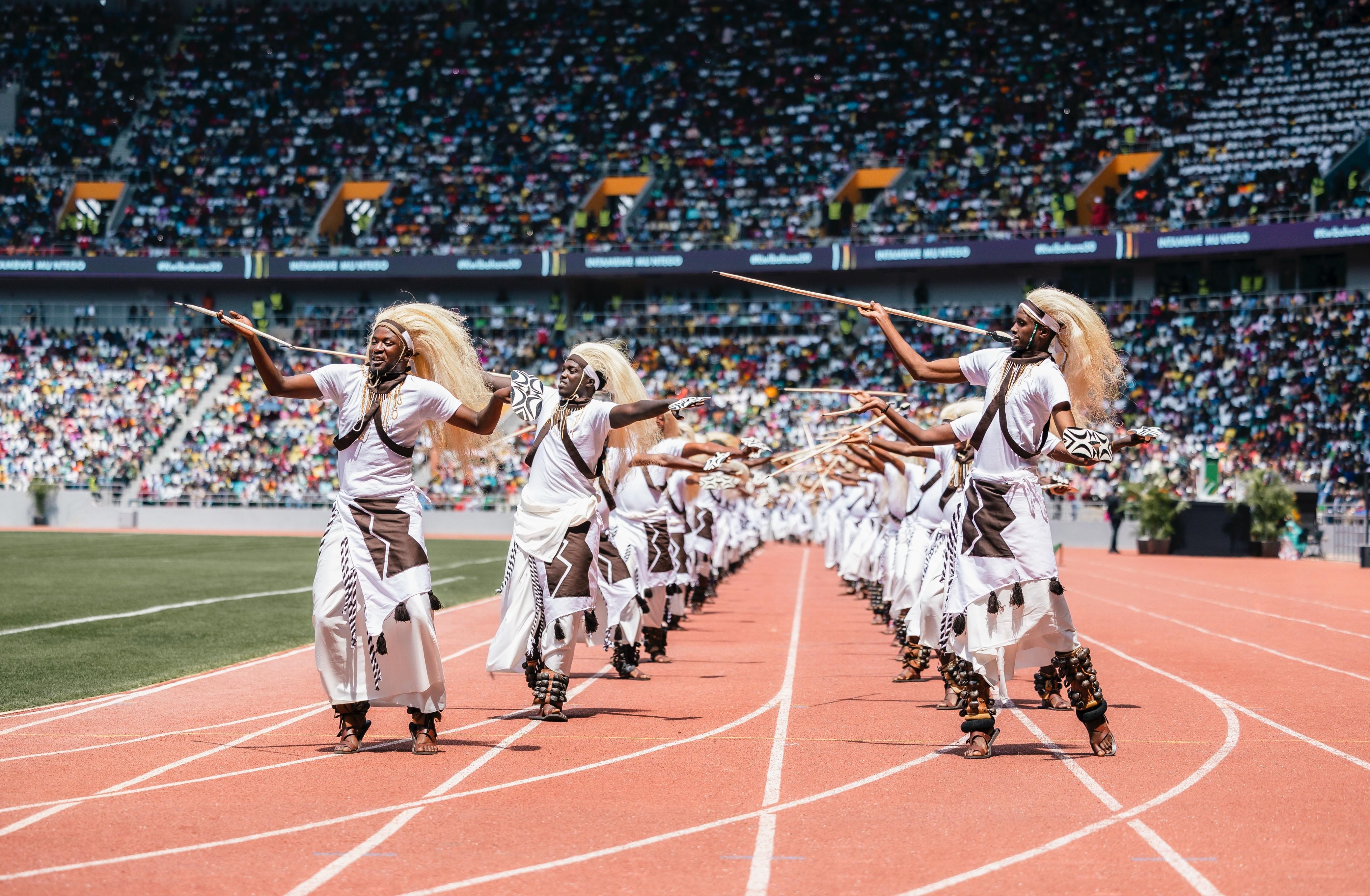 Traditional Dance Performance in Colorful Stadium · Free Stock Photo