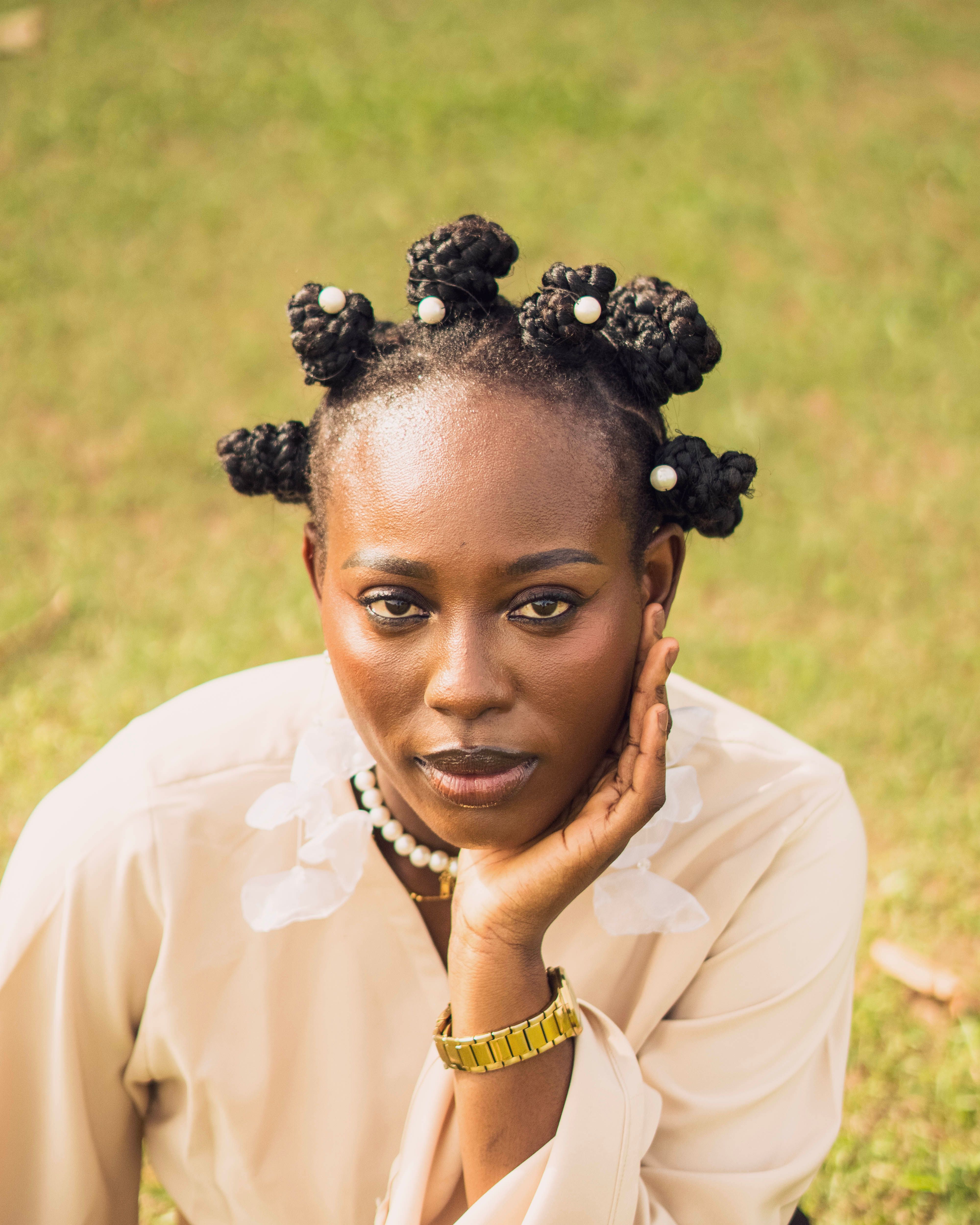 Portrait of Woman with Bantu Knots Outdoors · Free Stock Photo