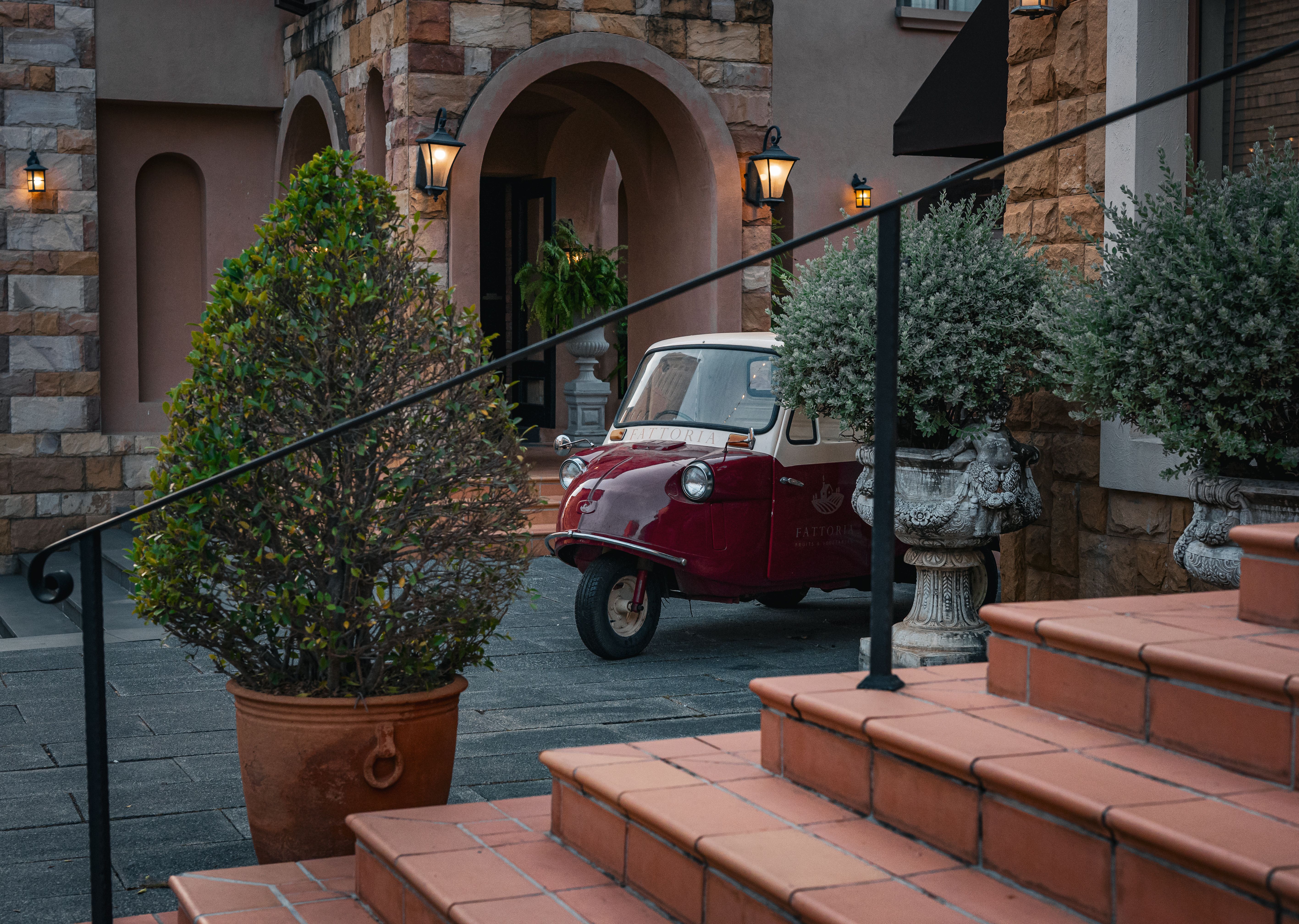 Vintage Car in Architectural Setting · Free Stock Photo