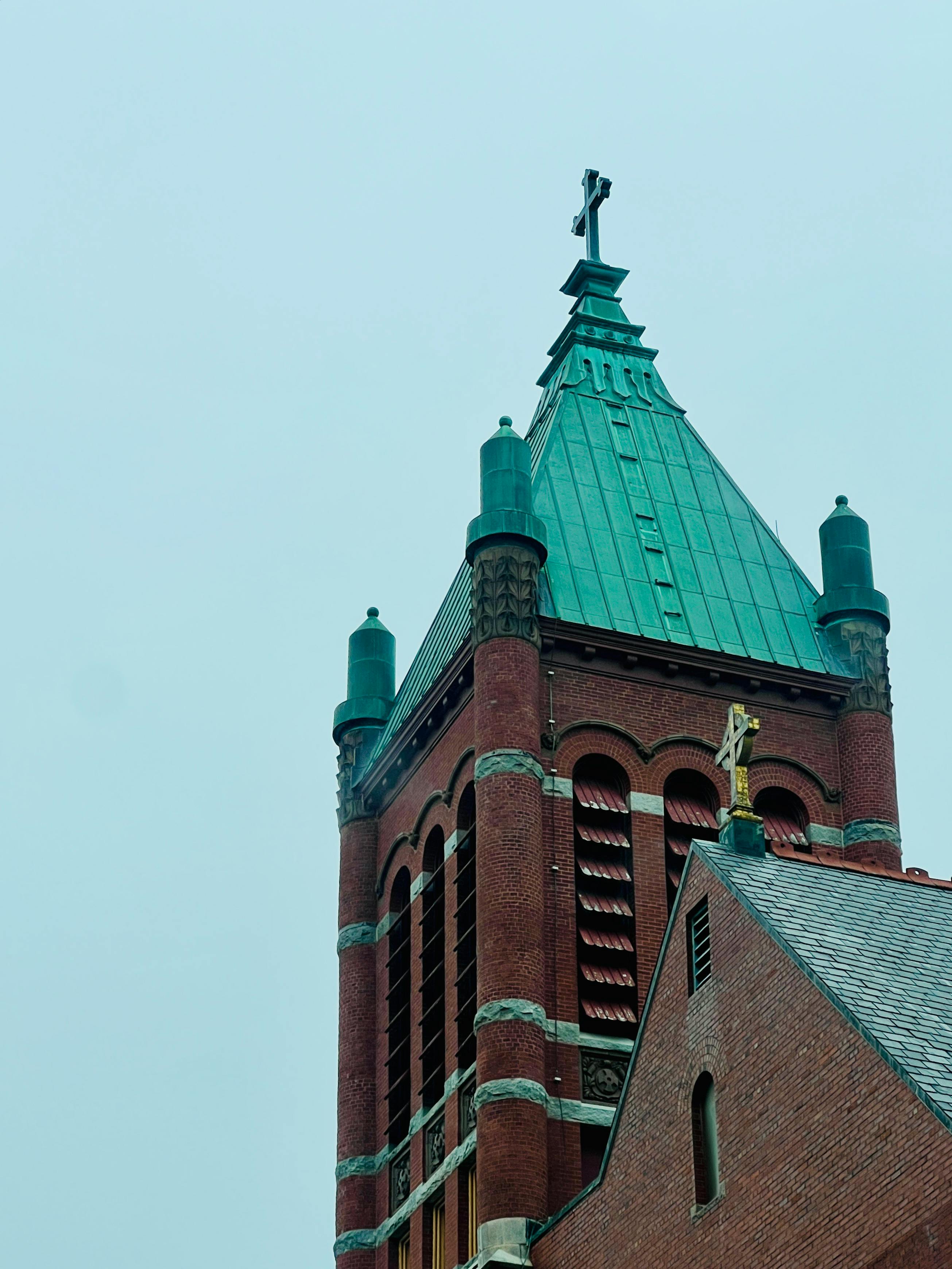 Historic Brick Church Tower with Copper Roof · Free Stock Photo