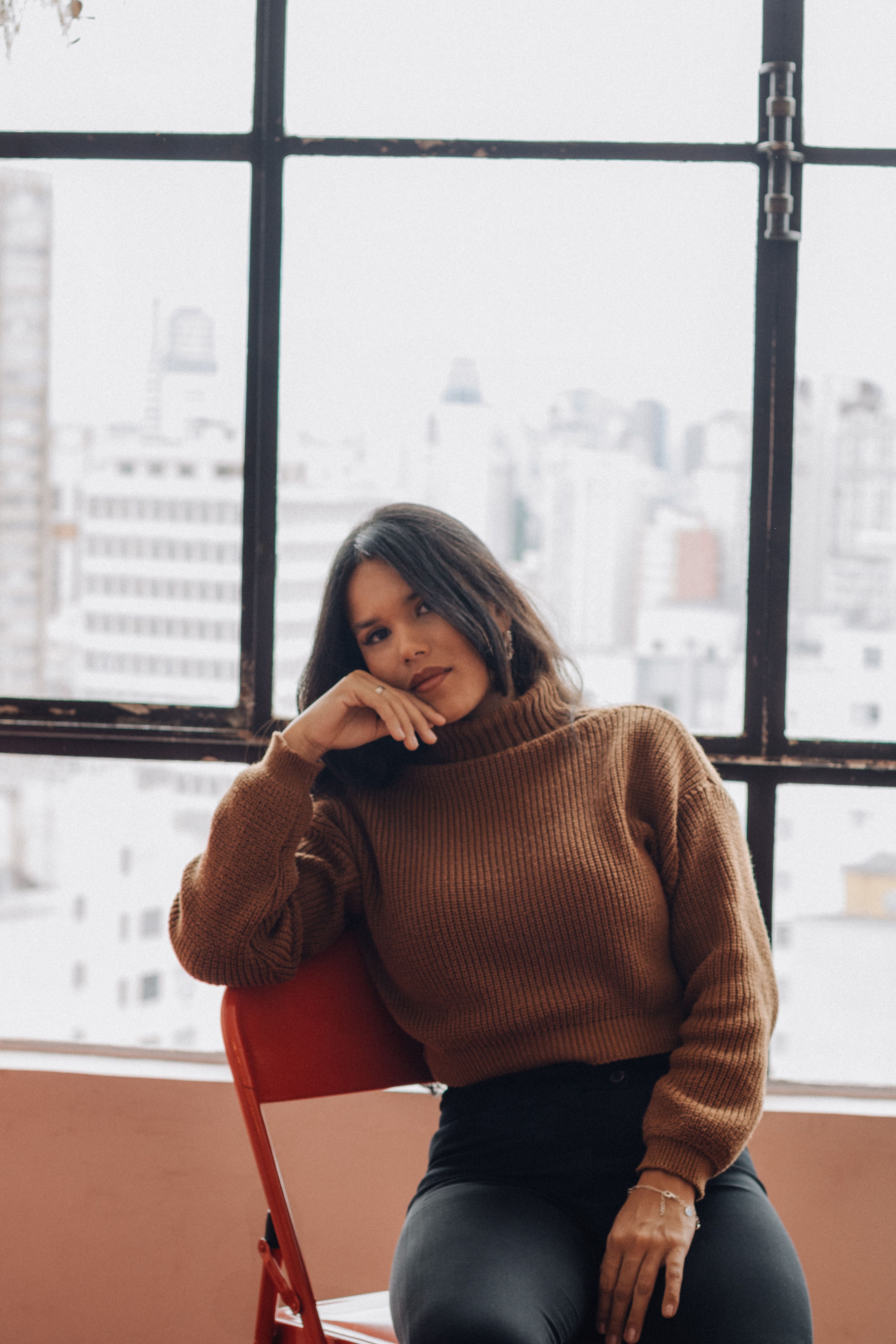 Relaxed Portrait of Woman by City Window · Free Stock Photo