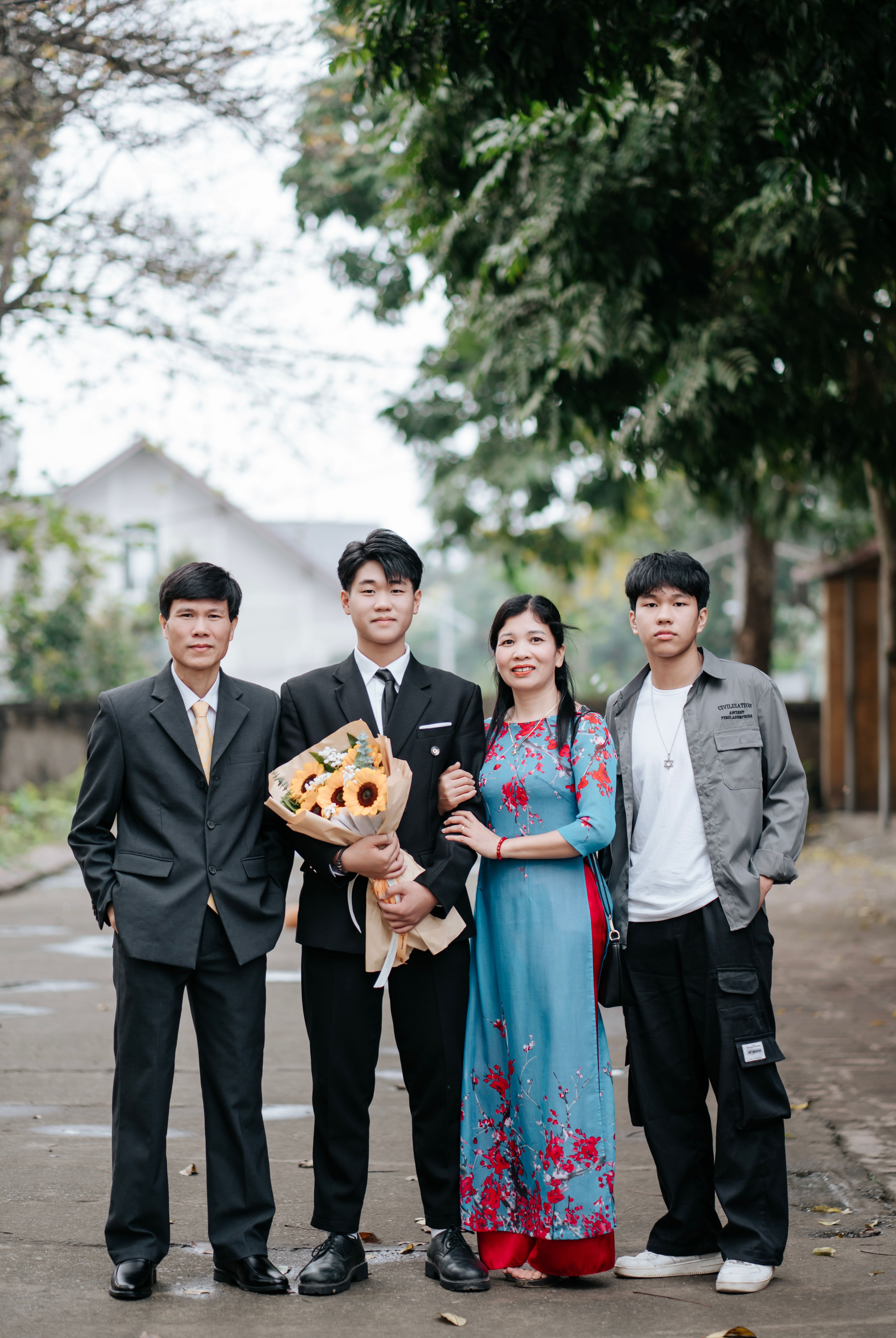 Happy Asian Family Celebrating Outdoors · Free Stock Photo