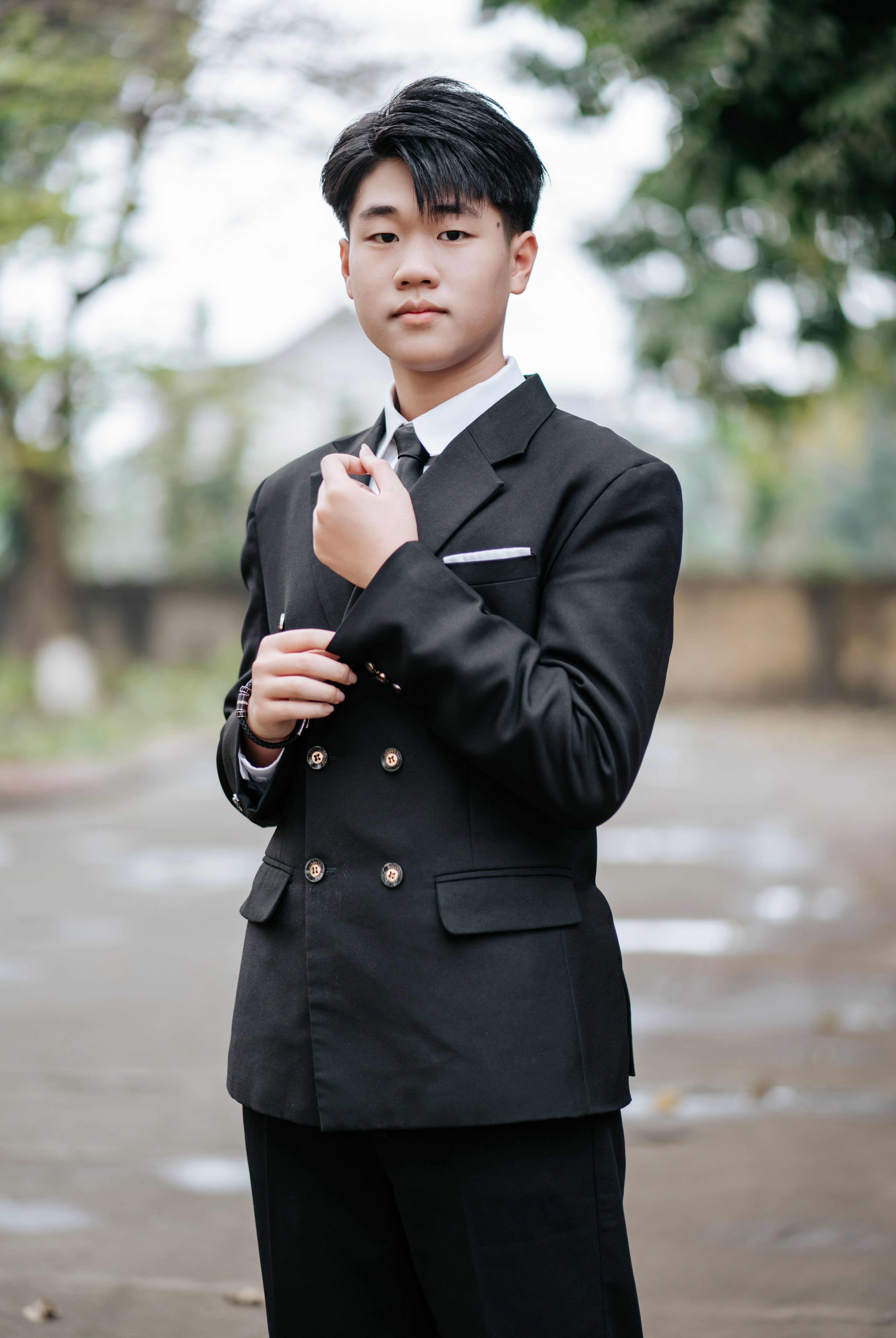 Young man in formal suit posing outdoors · Free Stock Photo