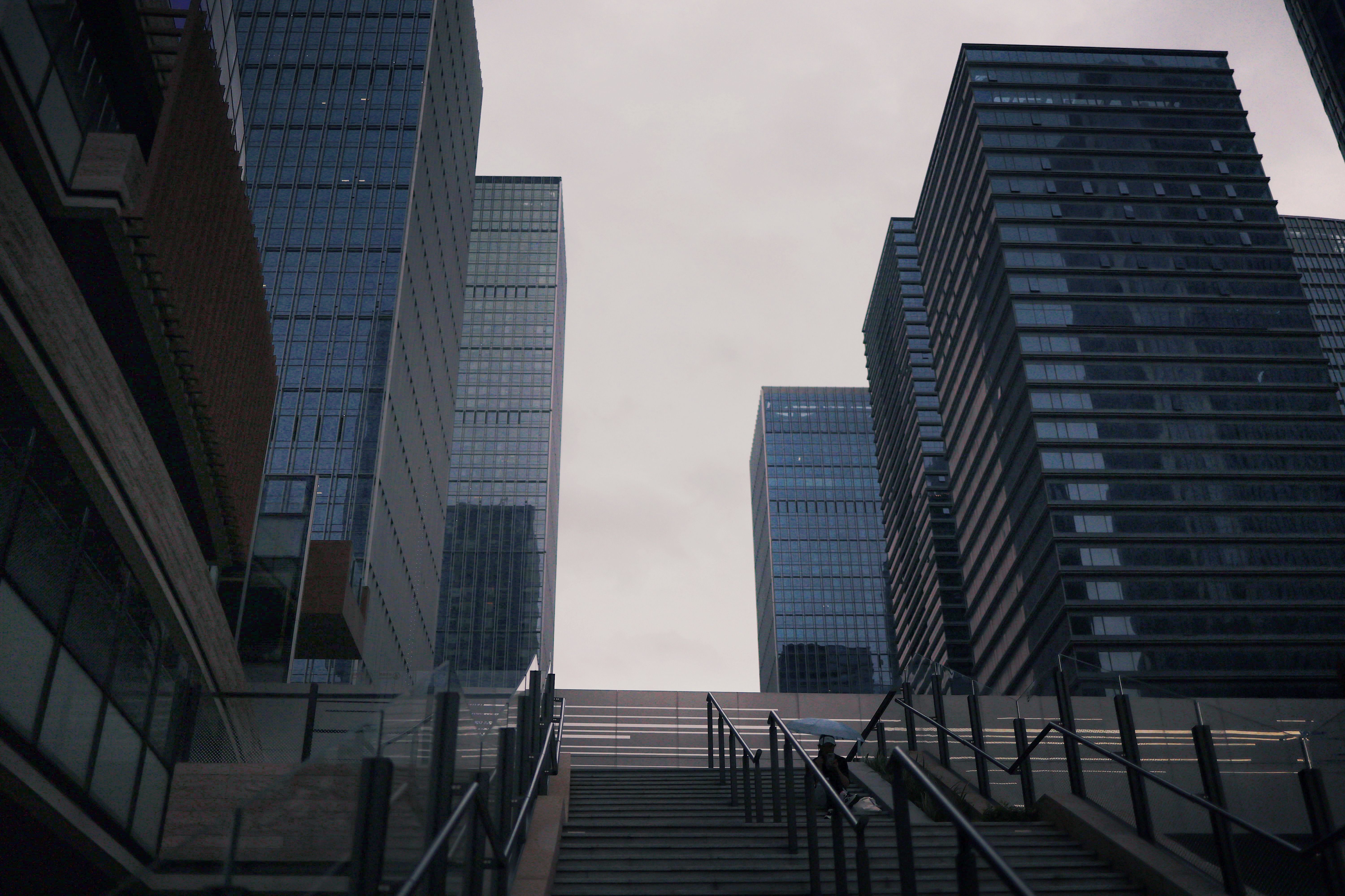 Modern Skyscrapers with Stairs Leading Upward · Free Stock Photo