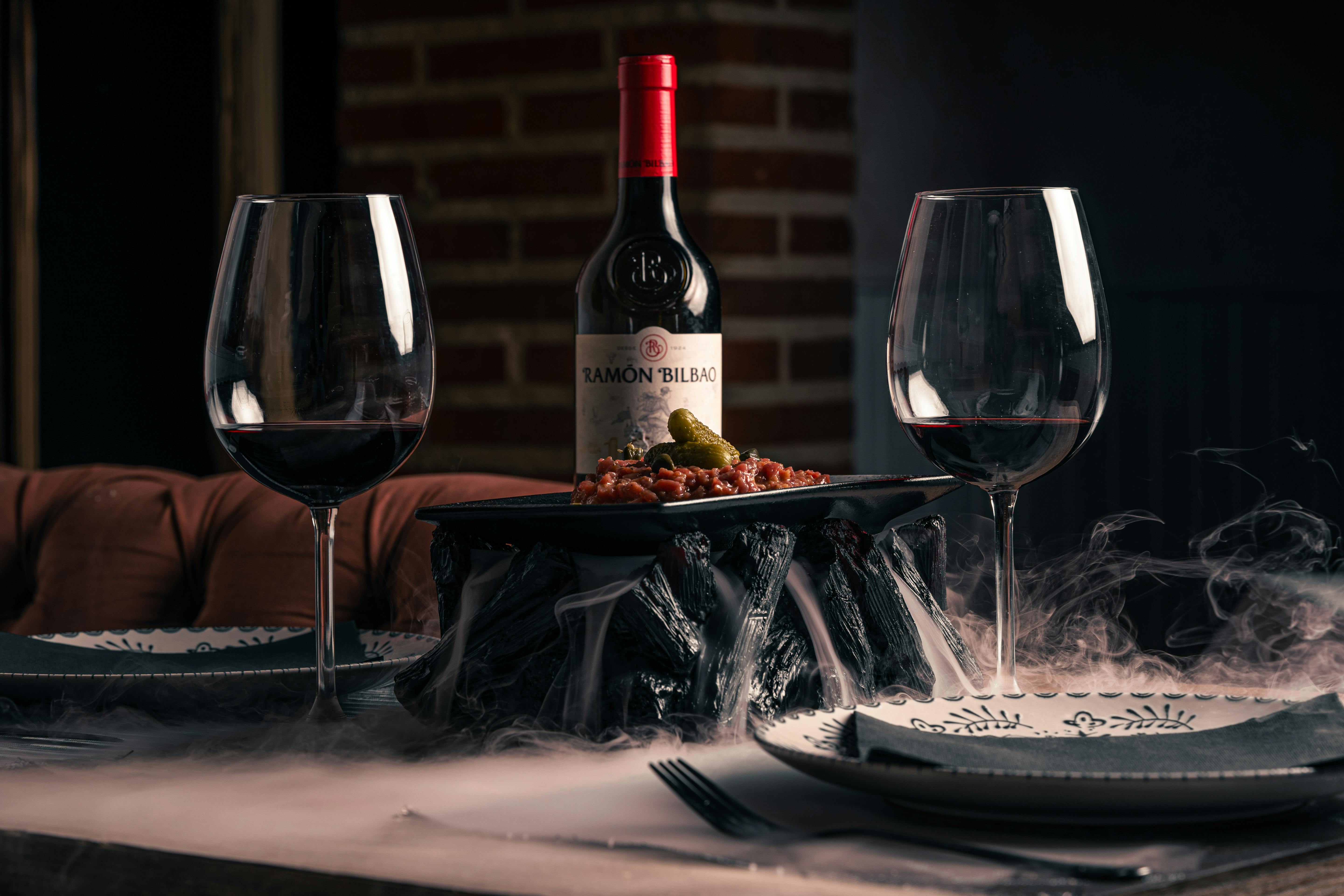 Elegant Wine Dinner Setting with Red Wine · Free Stock Photo