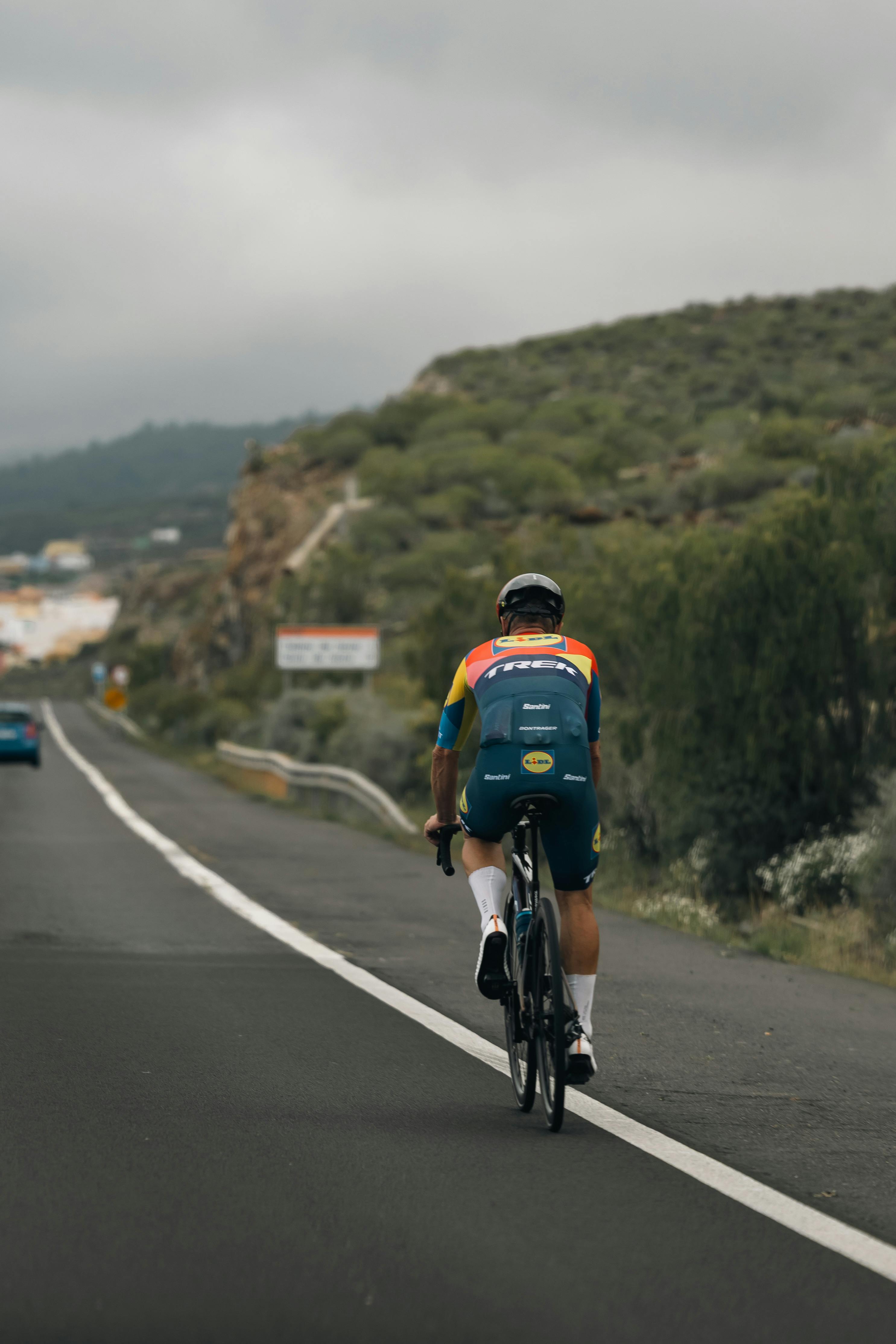 Cyclist on Scenic Road in Spanish Countryside · Free Stock Photo
