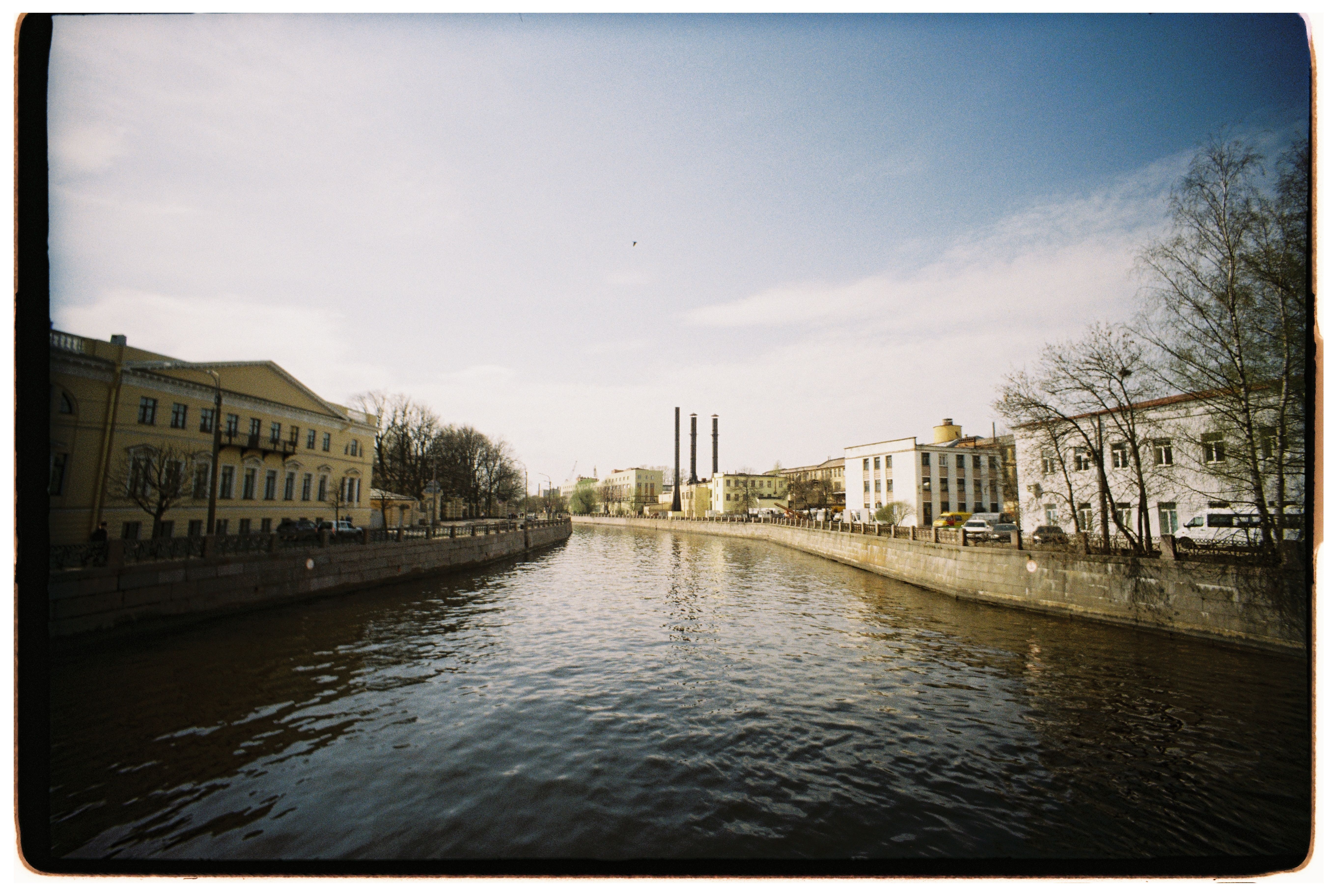 Urban River Canal Scene with Industrial Buildings · Free Stock Photo