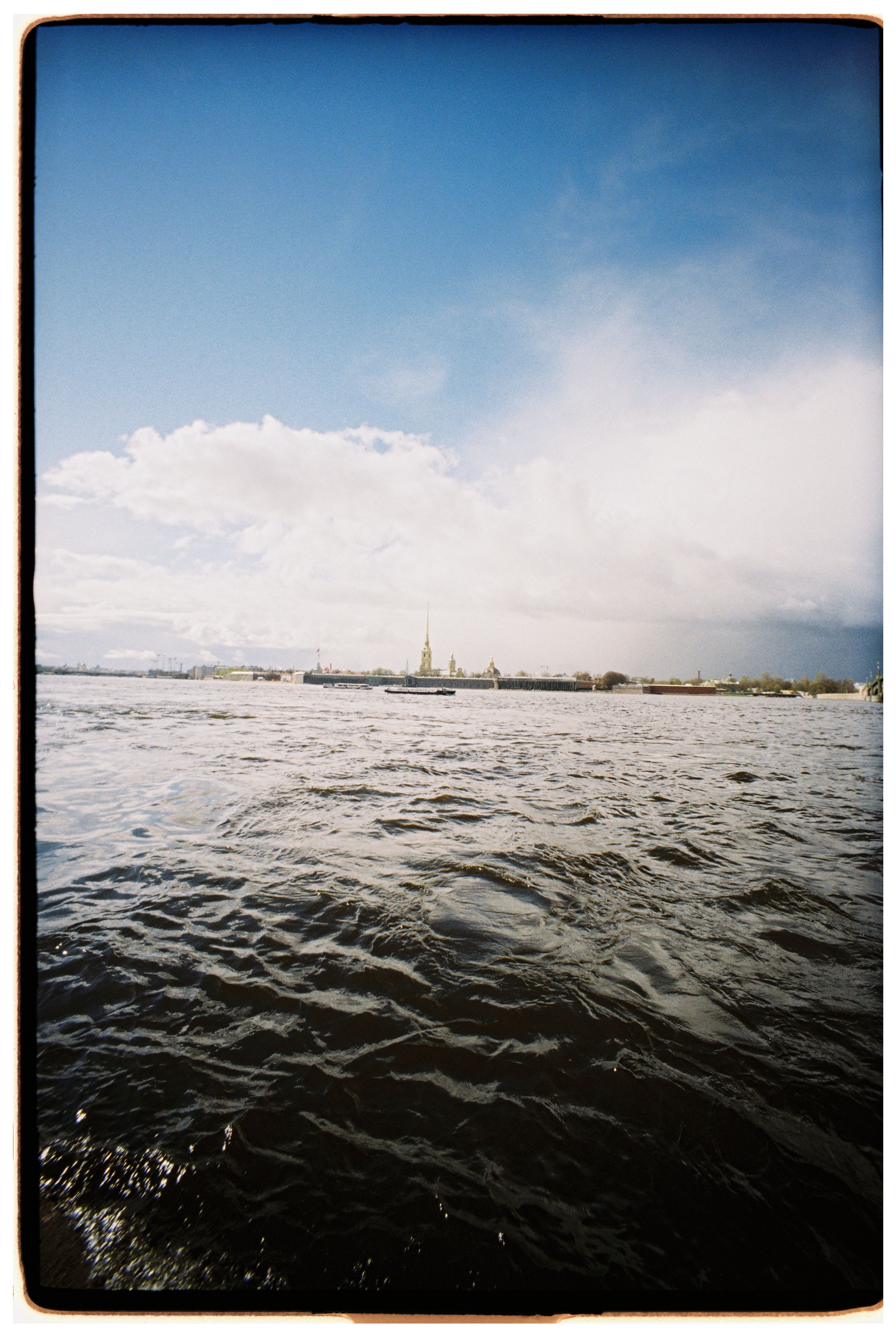 Scenic View of Waterfront with Historic Landmark · Free Stock Photo