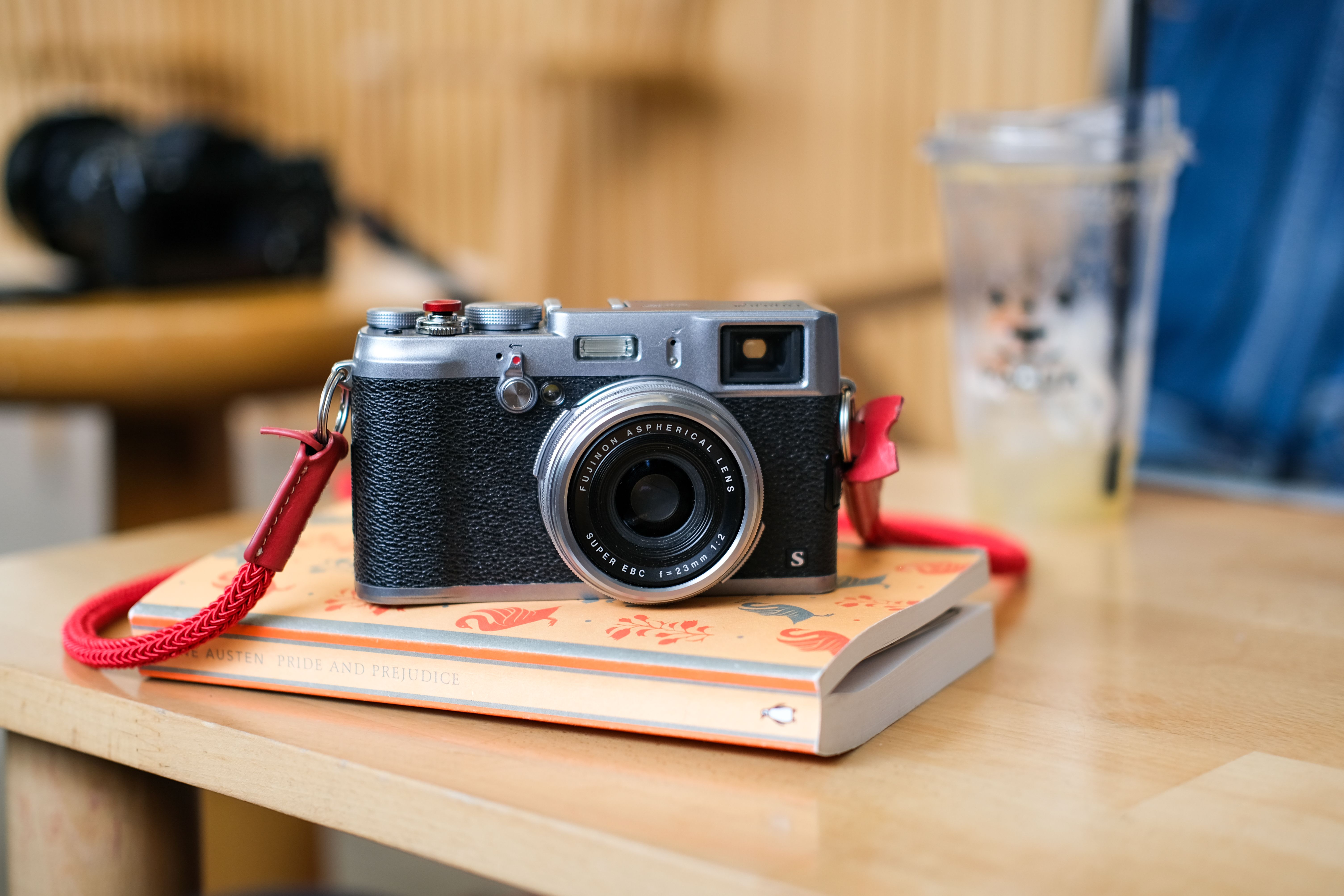Vintage Camera on Table with Book and Drink · Free Stock Photo