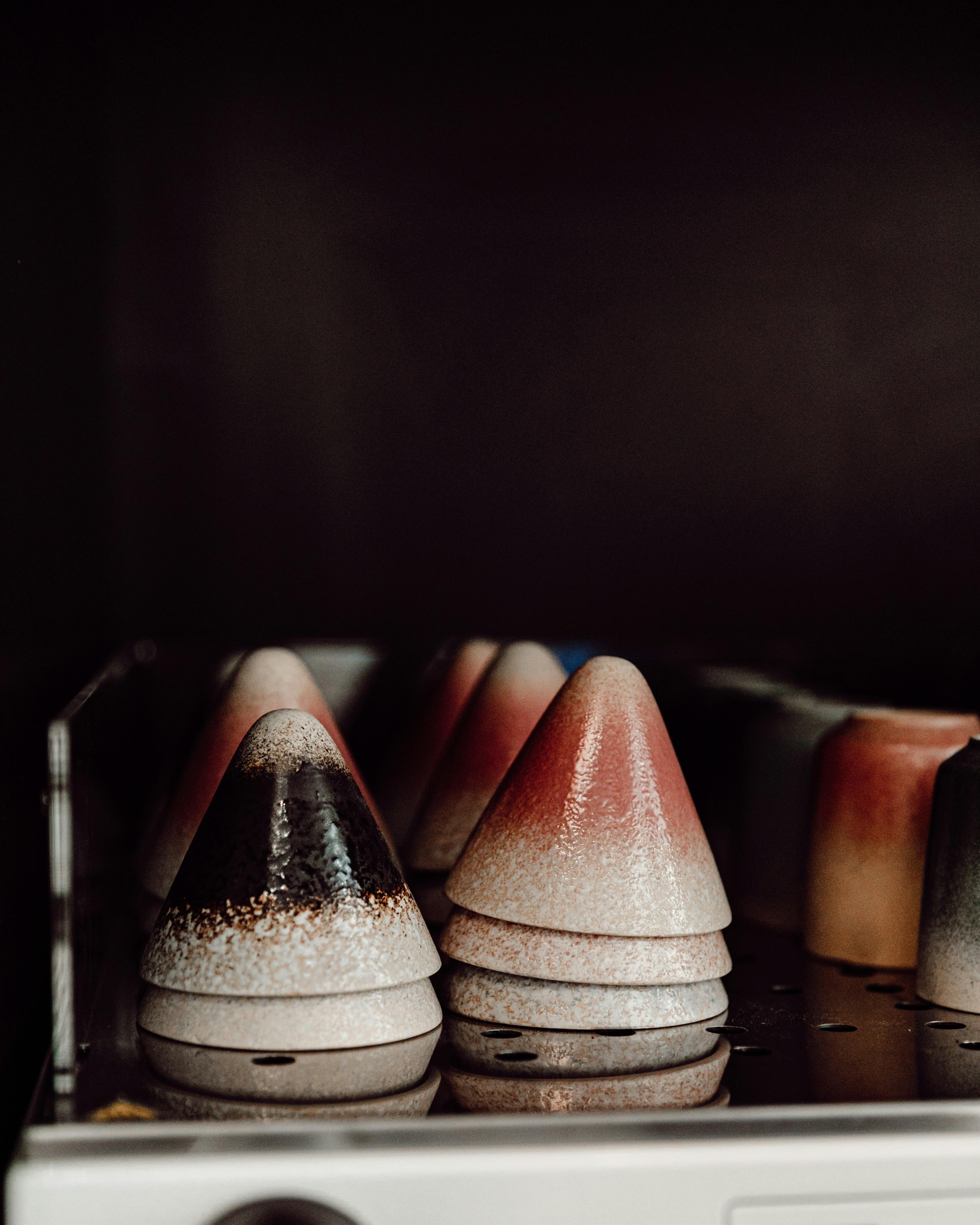 Artistic Ceramic Cones on Dark Background · Free Stock Photo