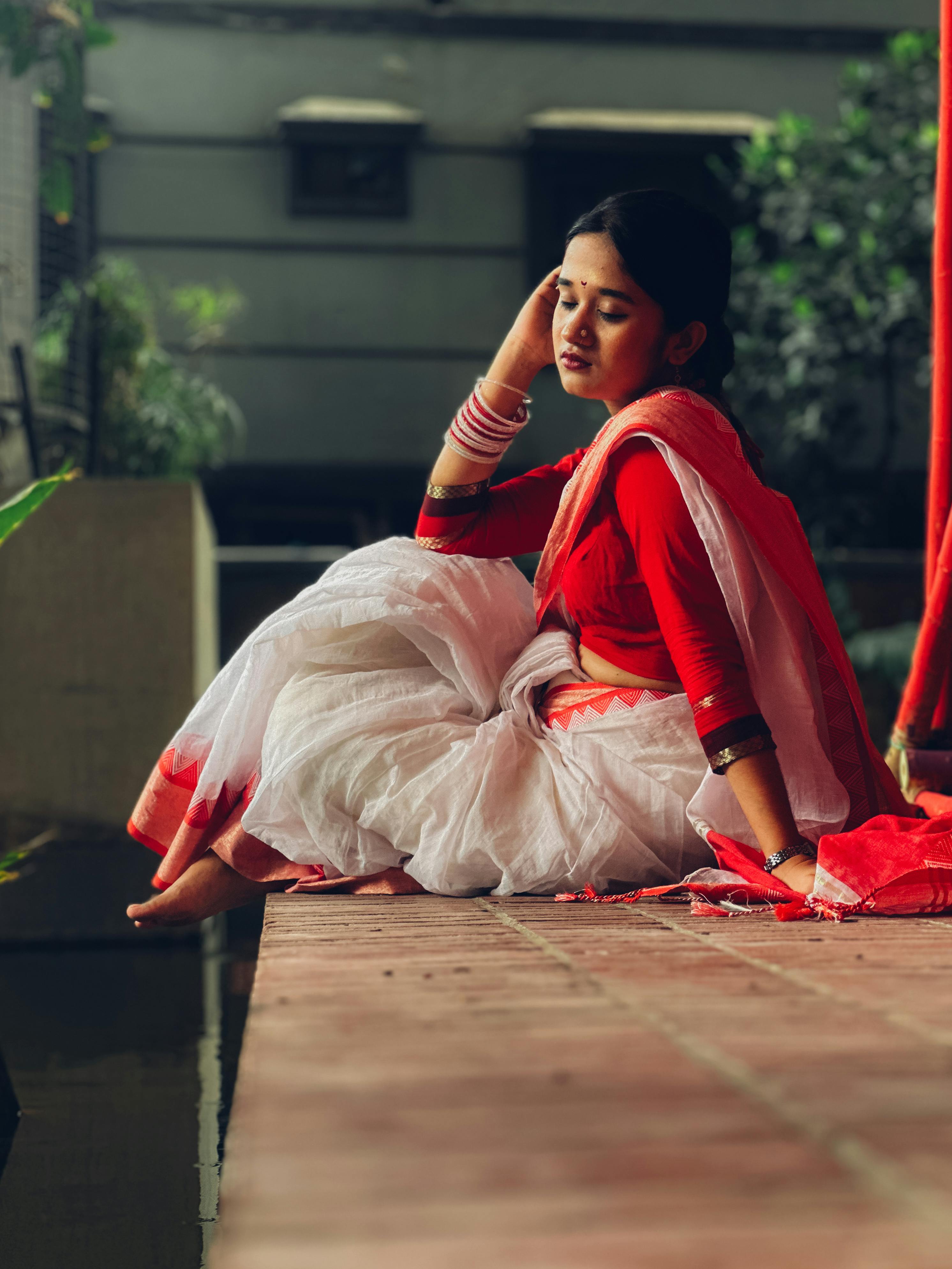 Young Woman in Traditional Red and White Attire · Free Stock Photo