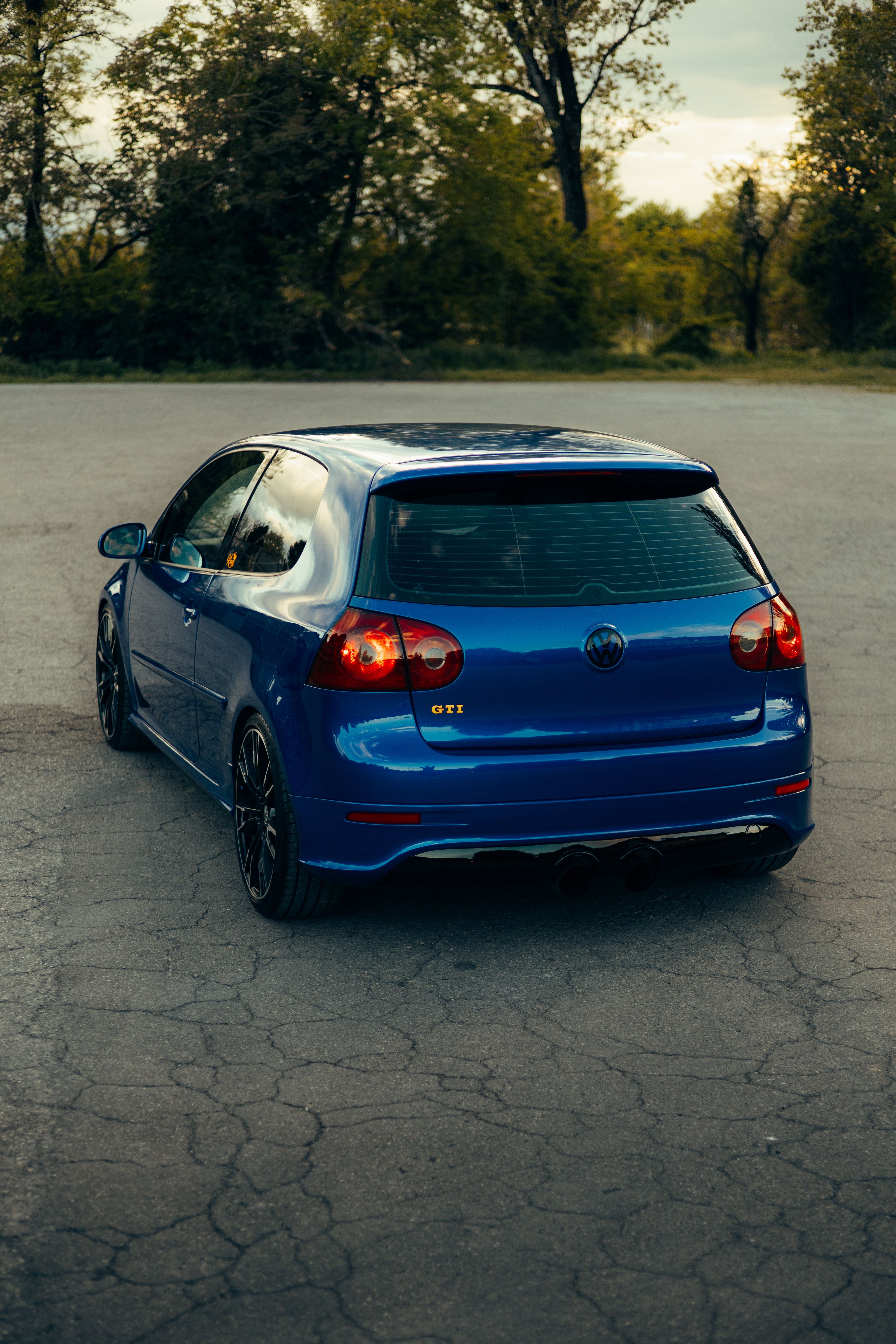 Vibrant Blue Hatchback Car in Outdoor Parking · Free Stock Photo