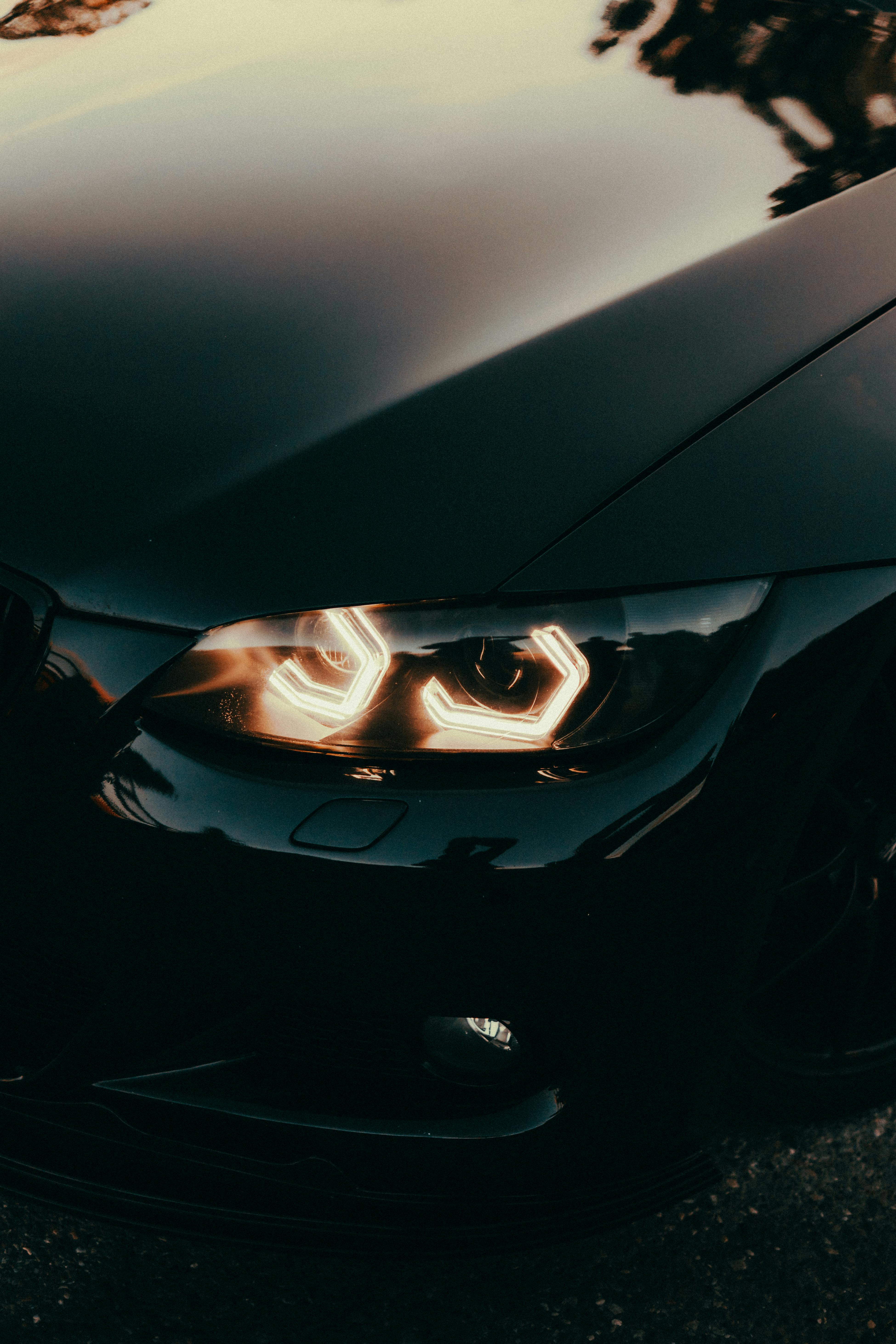Close Up of Luxury Car Headlights at Dusk · Free Stock Photo