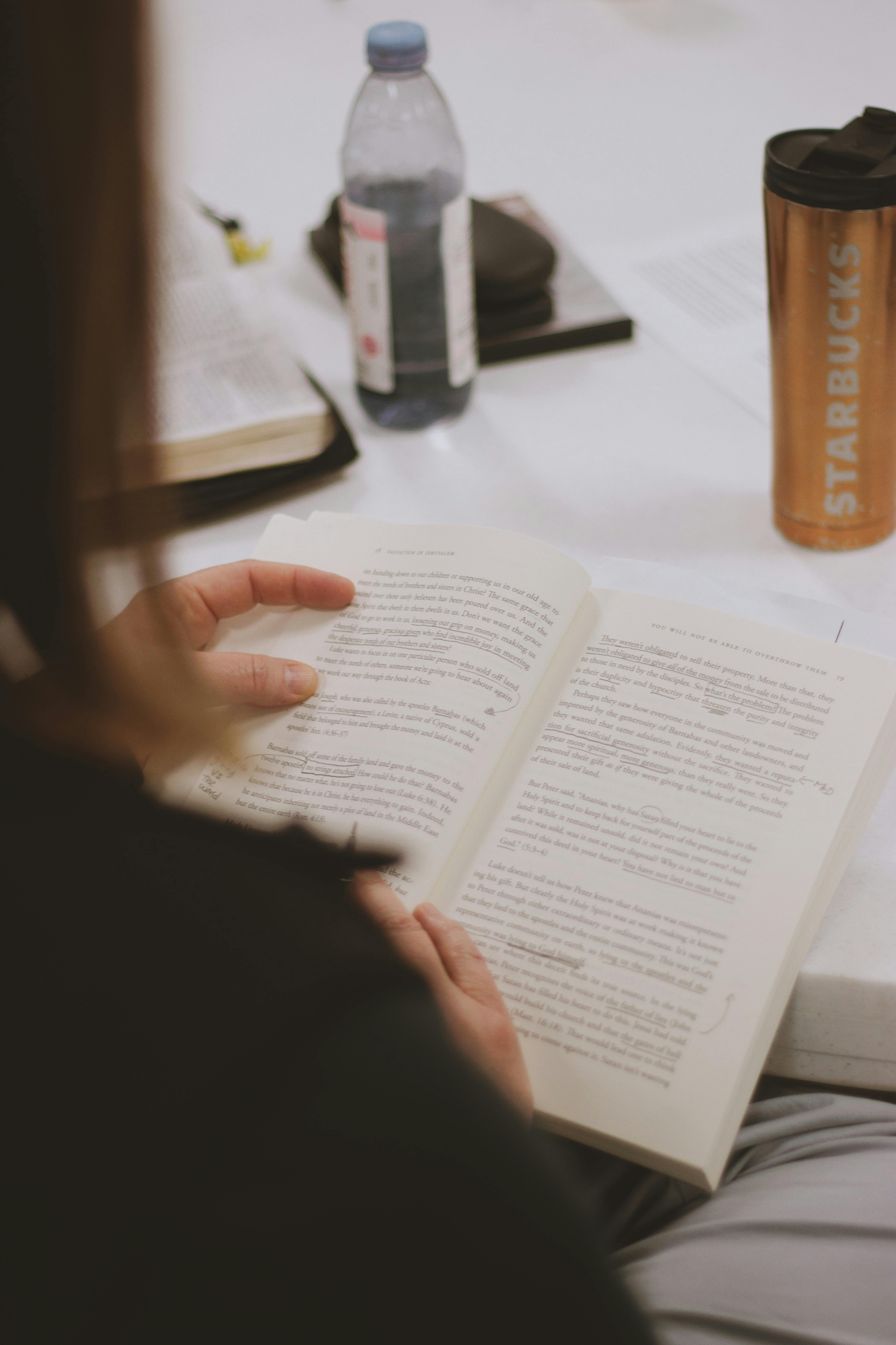 Woman Reading Book at Bible Study Gathering · Free Stock Photo