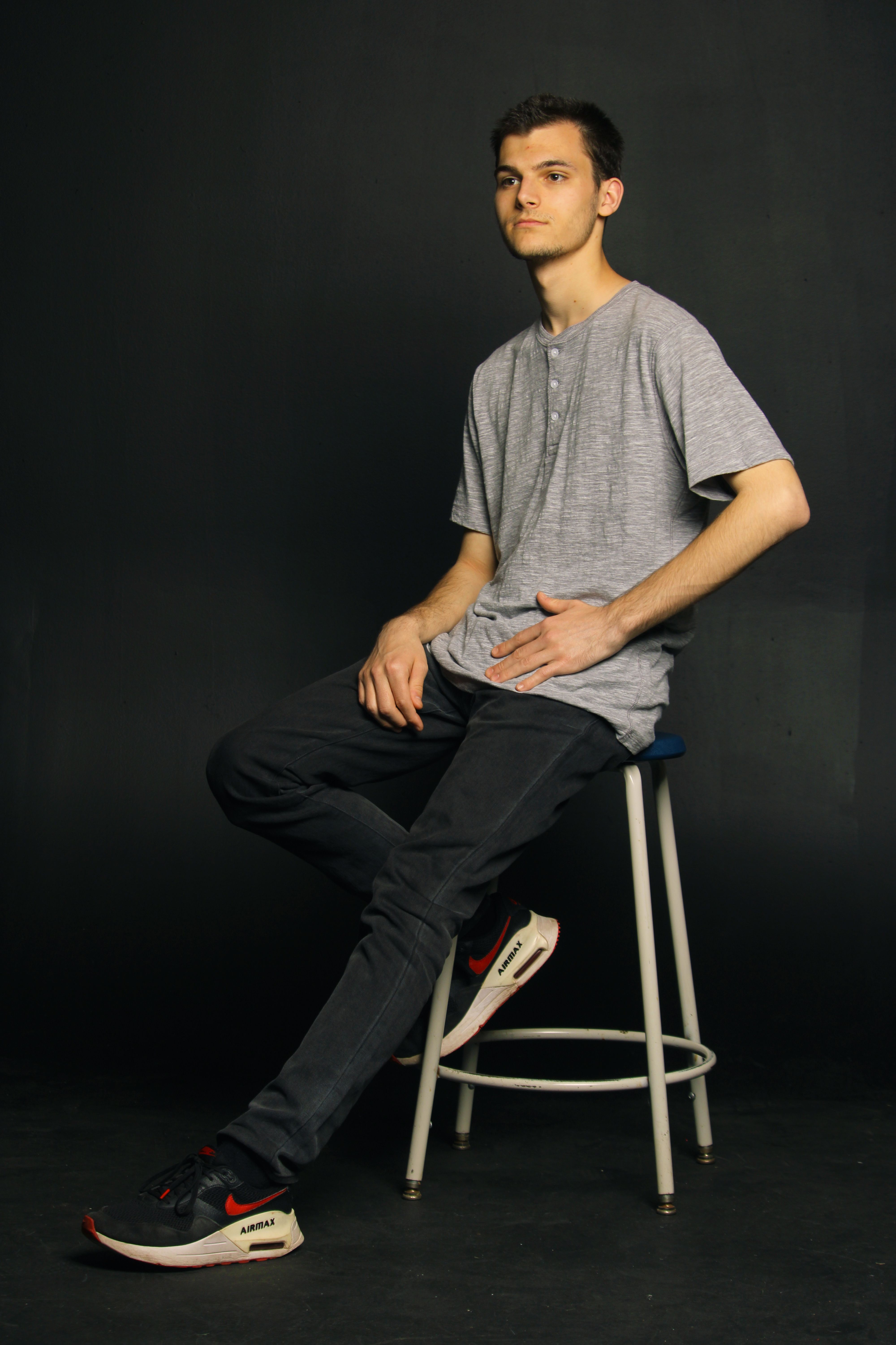 Casual Portrait of Man Seated on Stool · Free Stock Photo