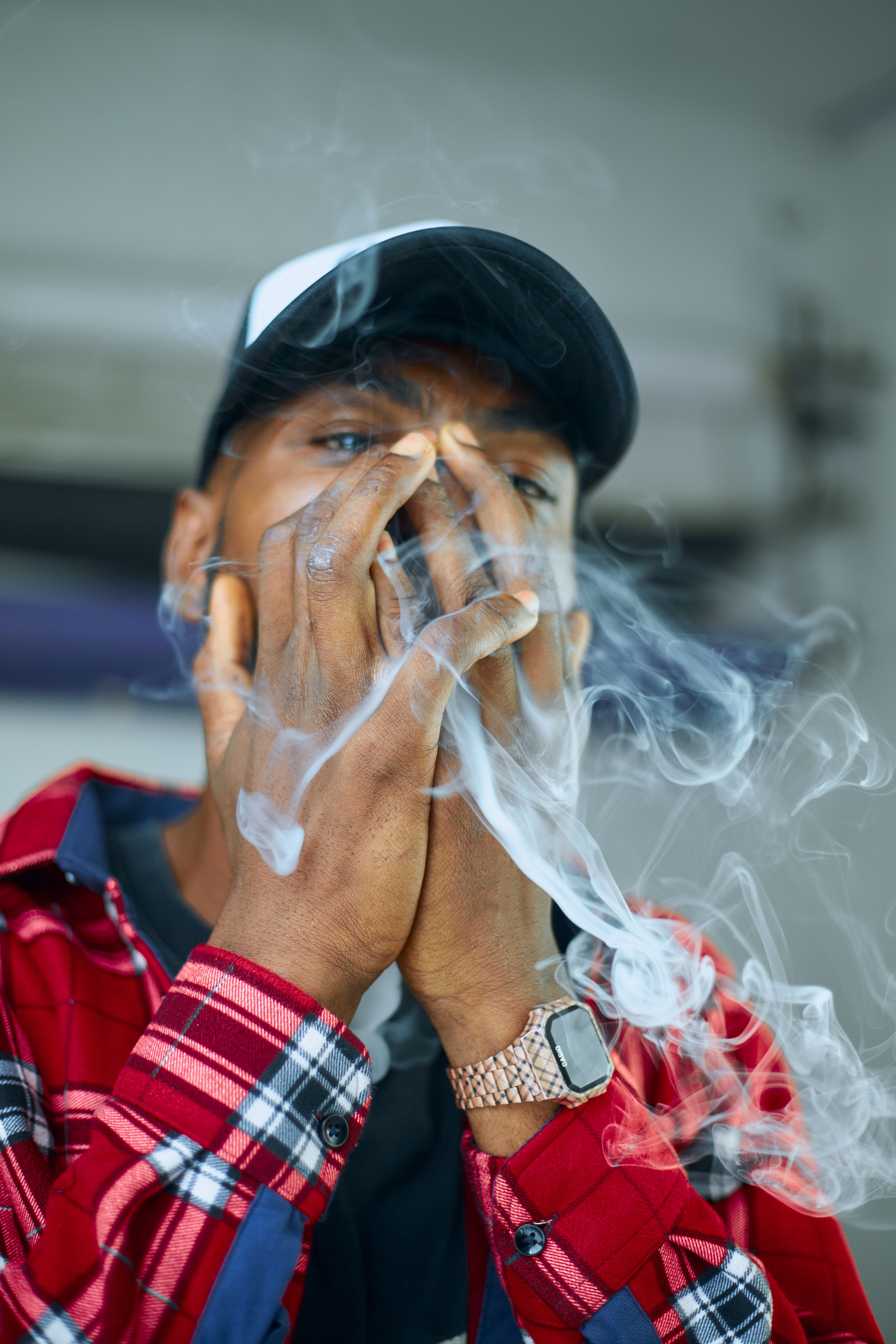 Shirtless Man Smoking with Face Covered with Smoke · Free Stock Photo