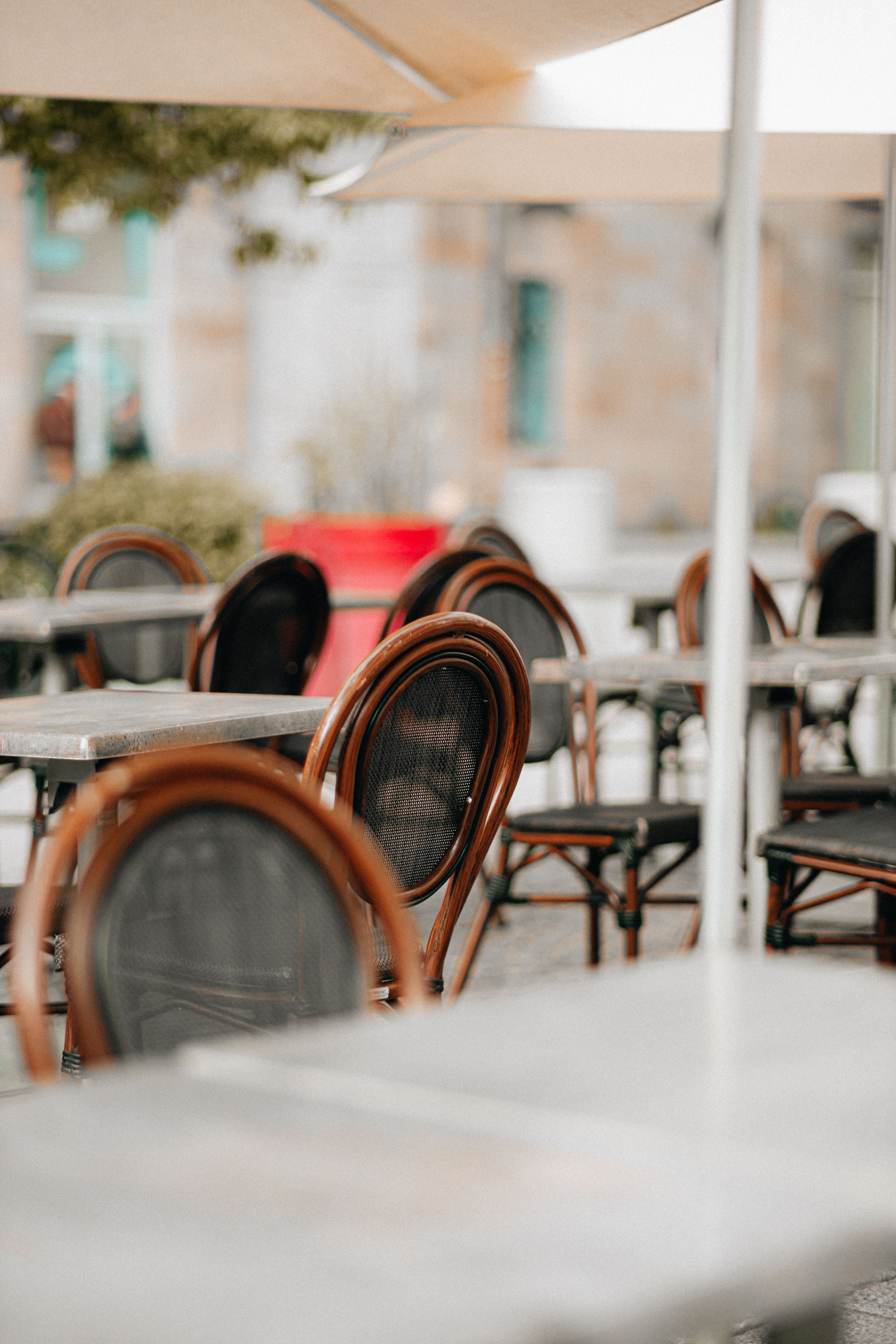 Charming Outdoor Café Seating on Sunny Day · Free Stock Photo