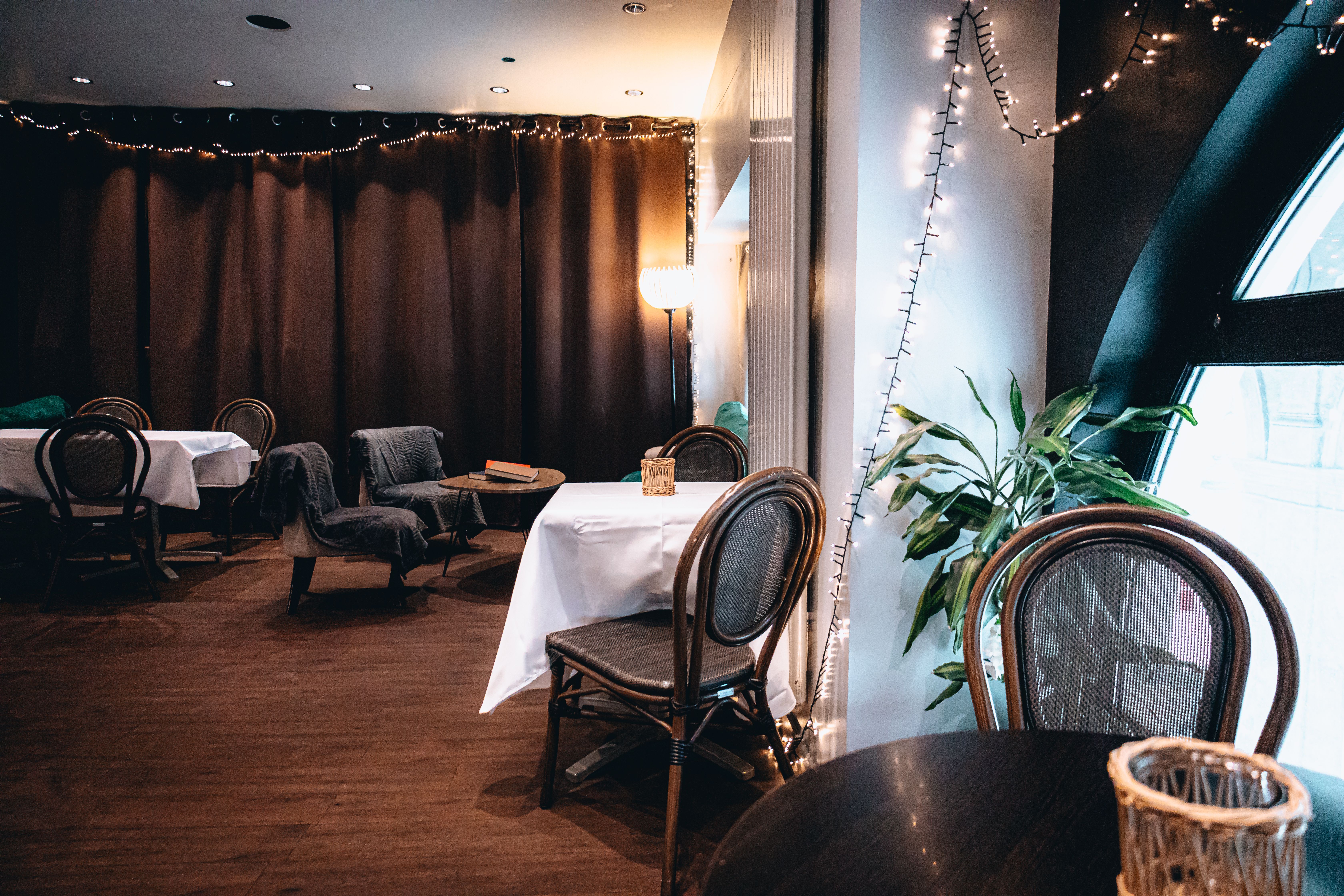 Cozy Indoor Cafe with Ambient Lighting · Free Stock Photo