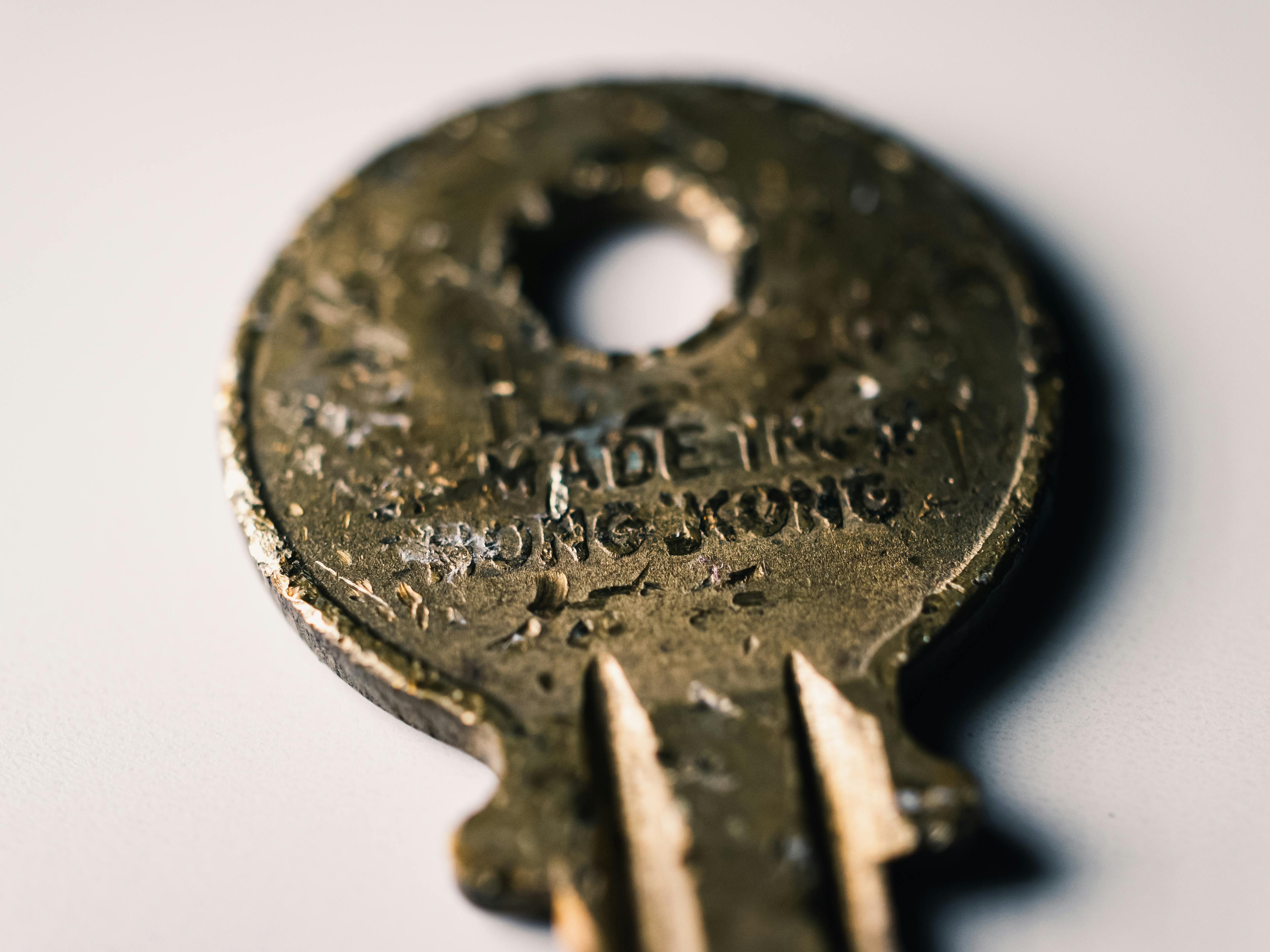 Close-up of an Old Rusty Key with Text · Free Stock Photo