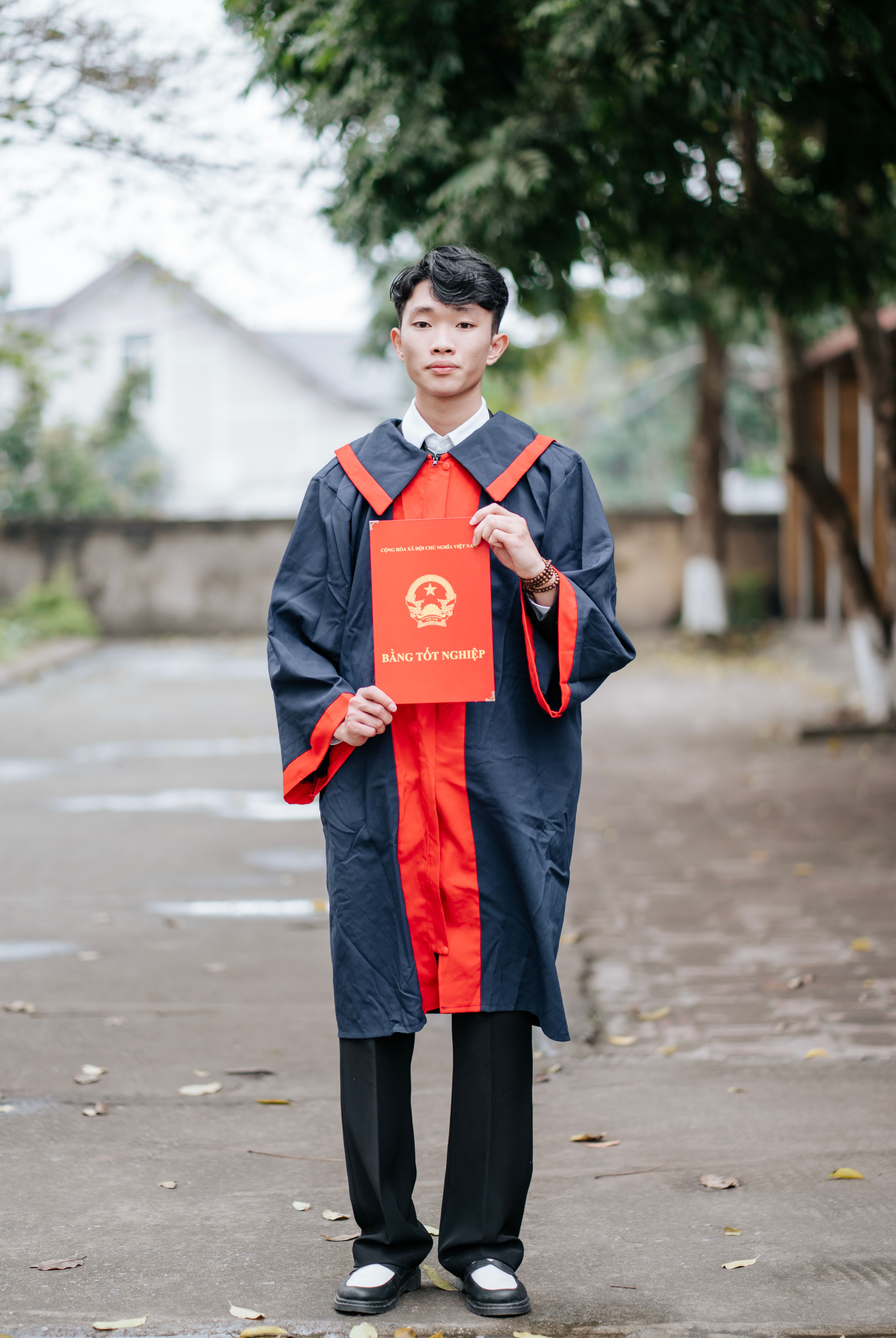 Graduation Ceremony with Diploma Holder · Free Stock Photo