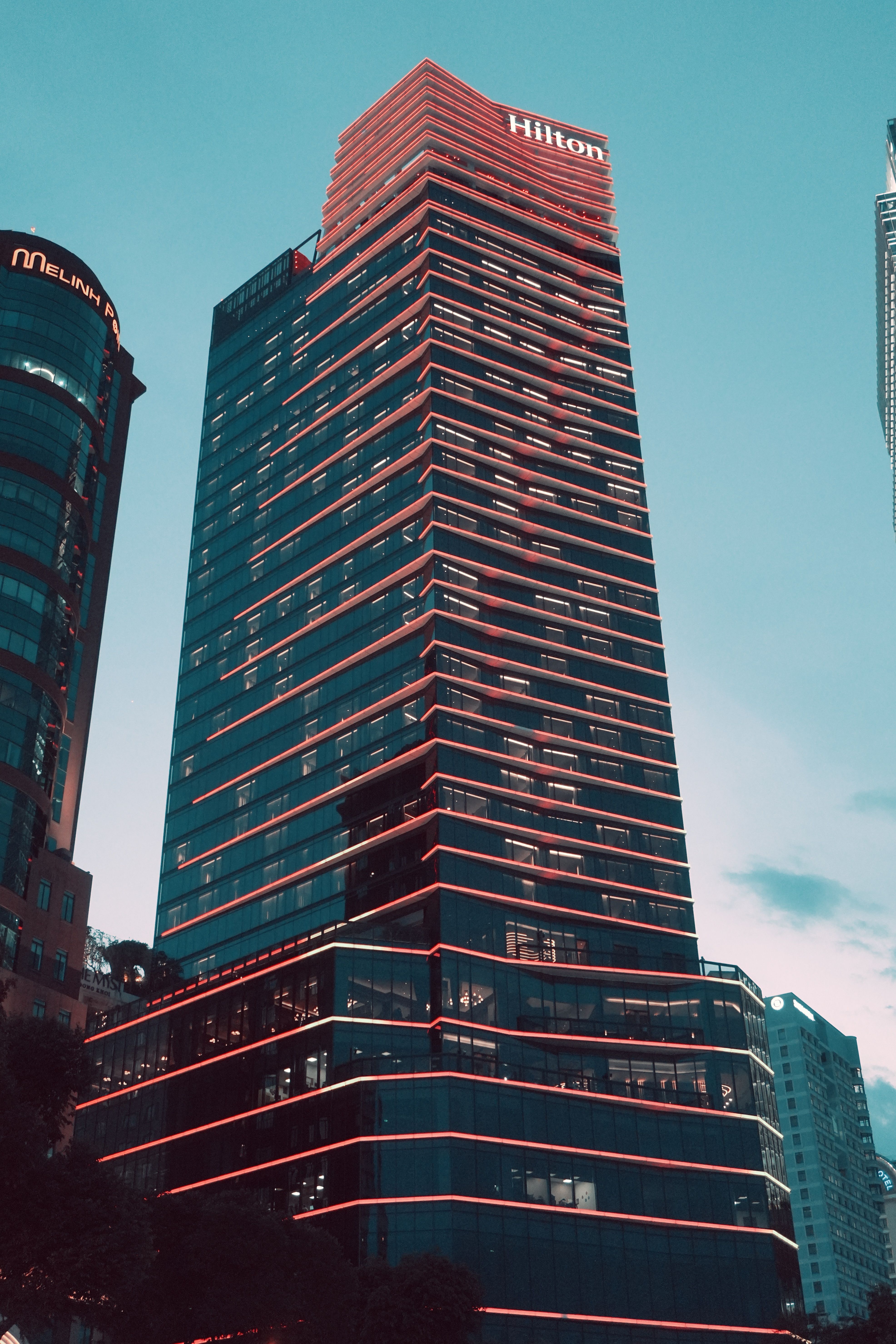 Illuminated Hilton Hotel in Ho Chi Minh City · Free Stock Photo