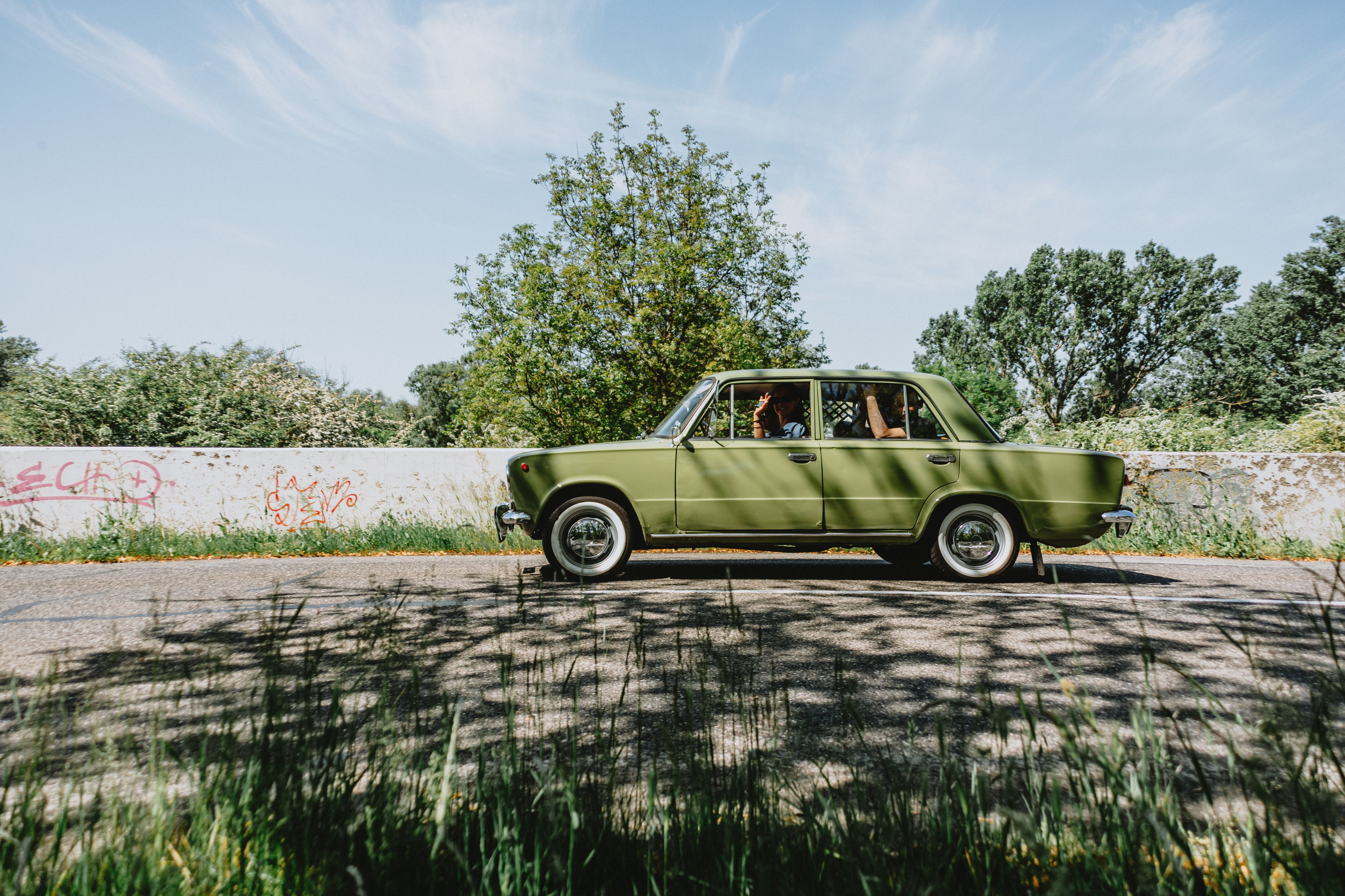 Vintage Green Car on Countryside Roadside · Free Stock Photo