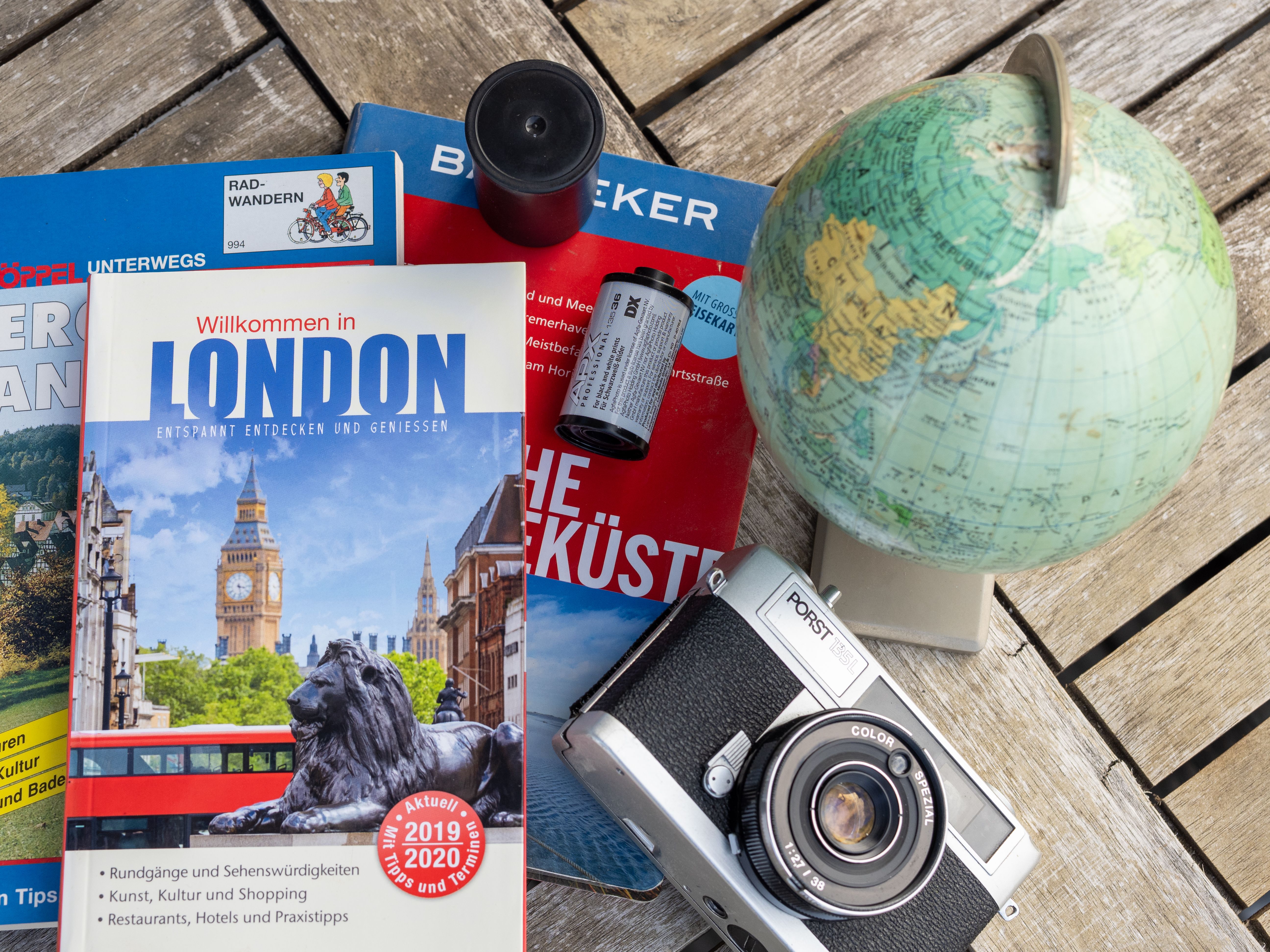Travel Guides and Vintage Camera Flat Lay · Free Stock Photo