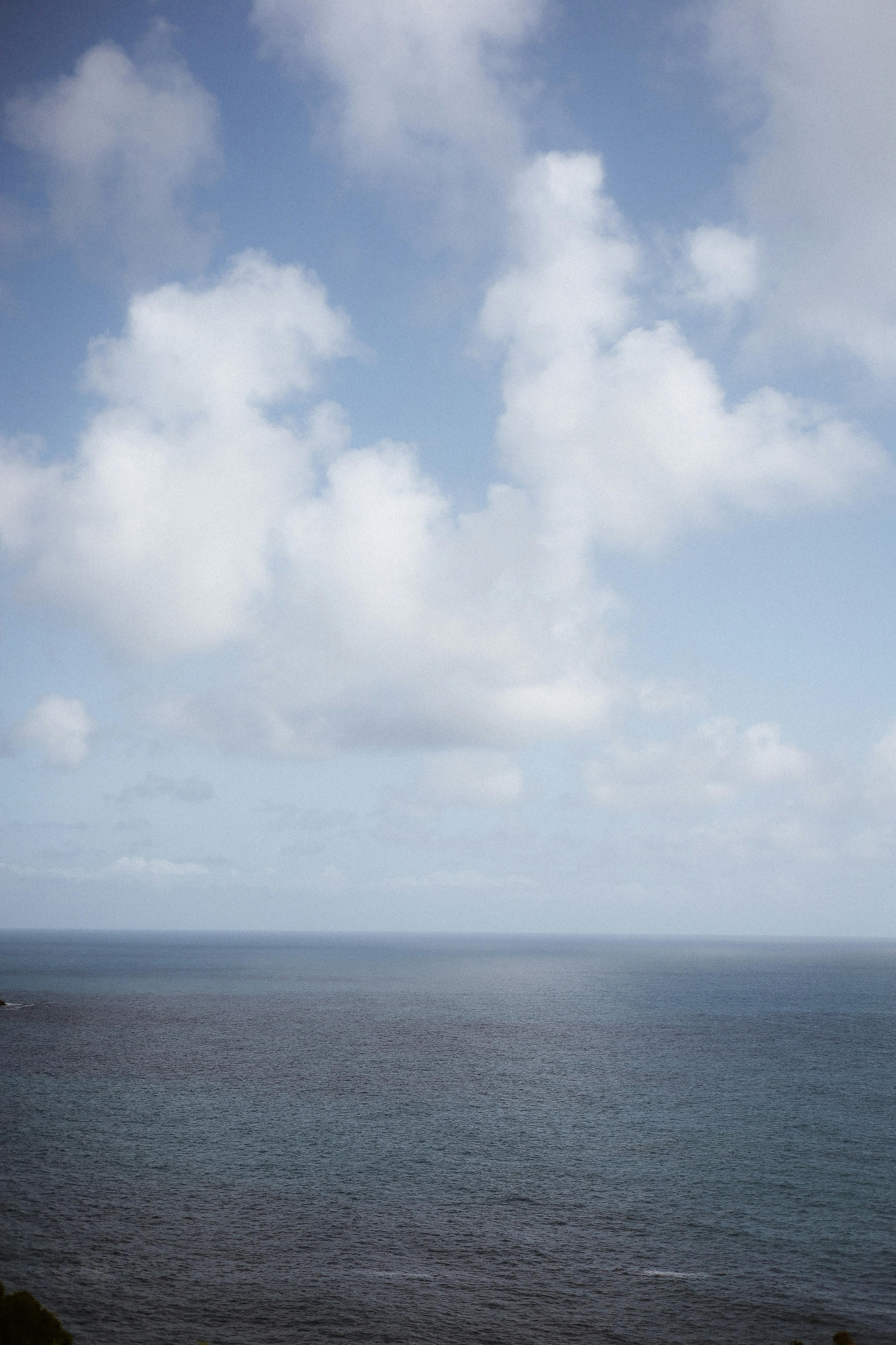 Calm Ocean View with Cloudy Sky and Horizon · Free Stock Photo