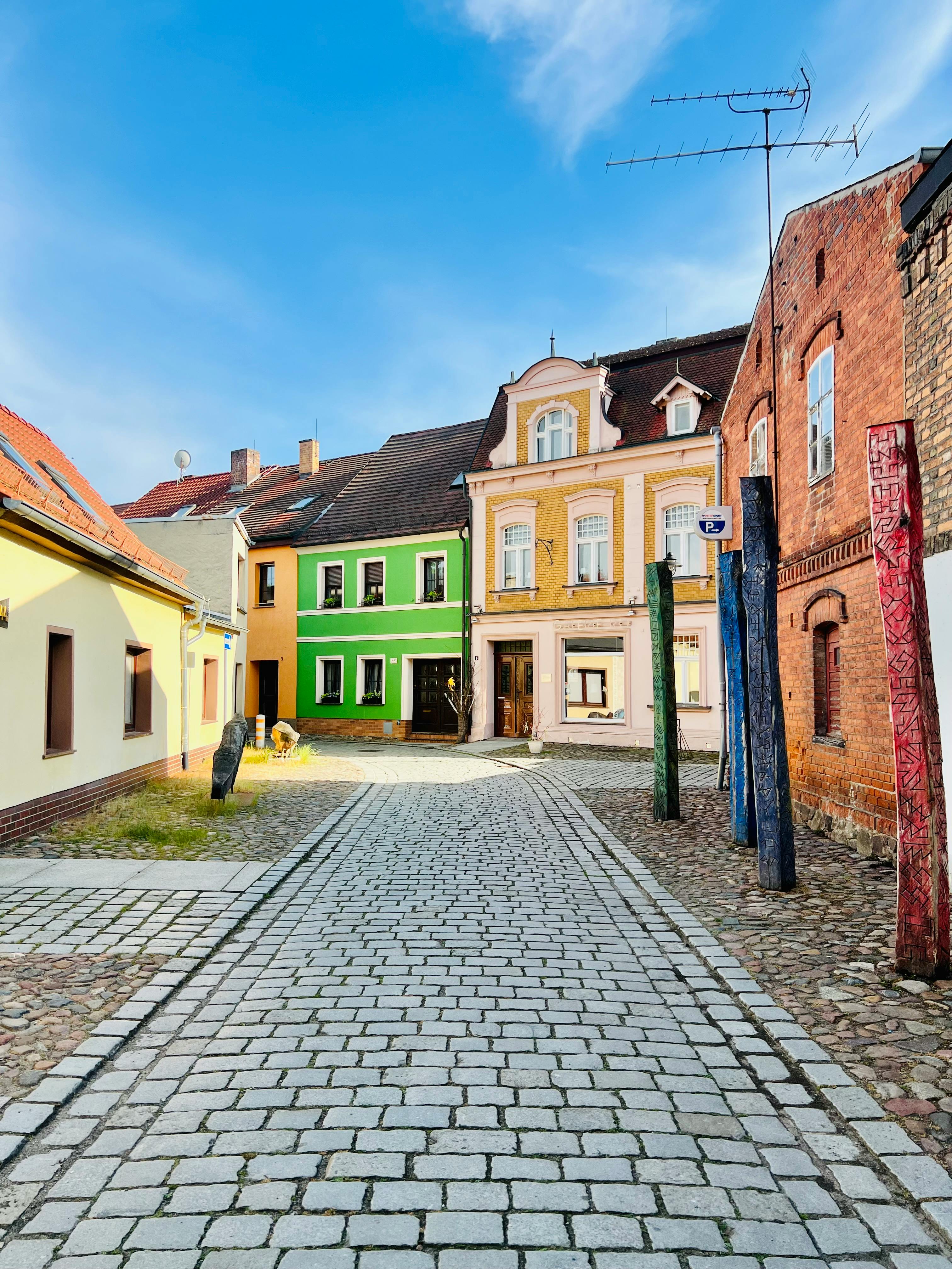 Colorful European Street with Cobblestone Pathway · Free Stock Photo