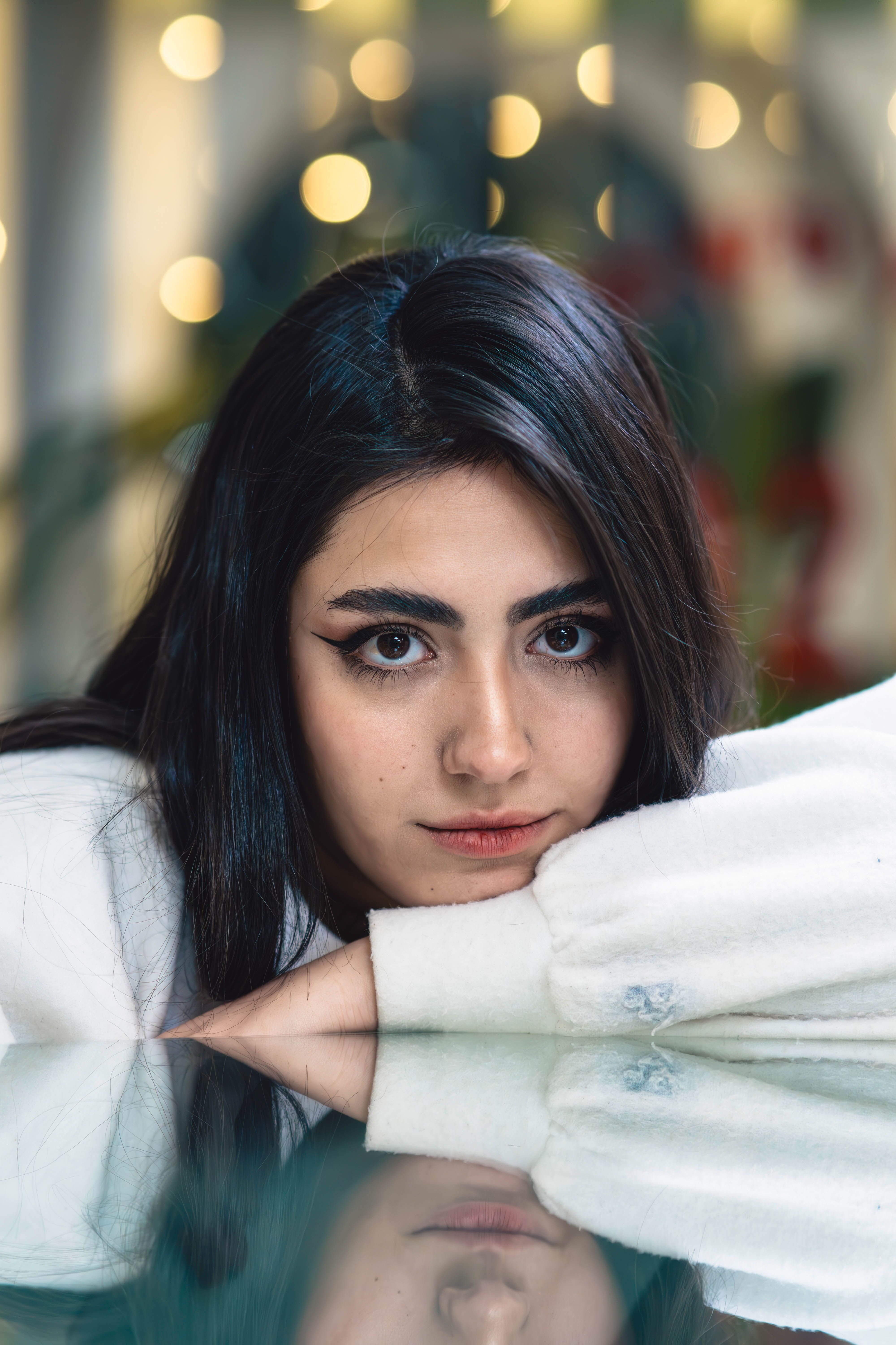 Artistic Portrait of a Woman with Reflective Surface · Free Stock Photo