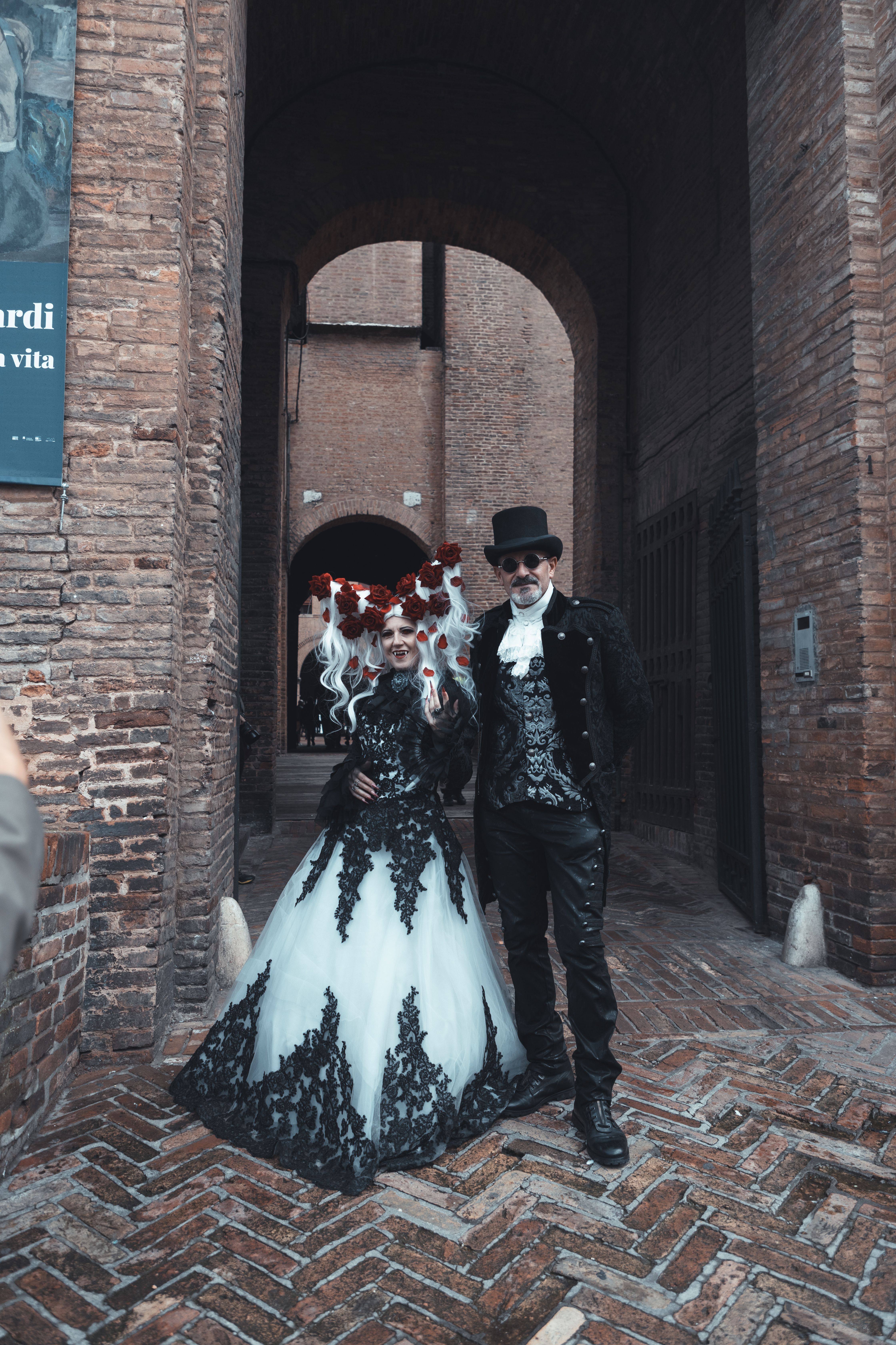 Gothic Couple in Ornate Costumes at Historical Venue · Free Stock Photo