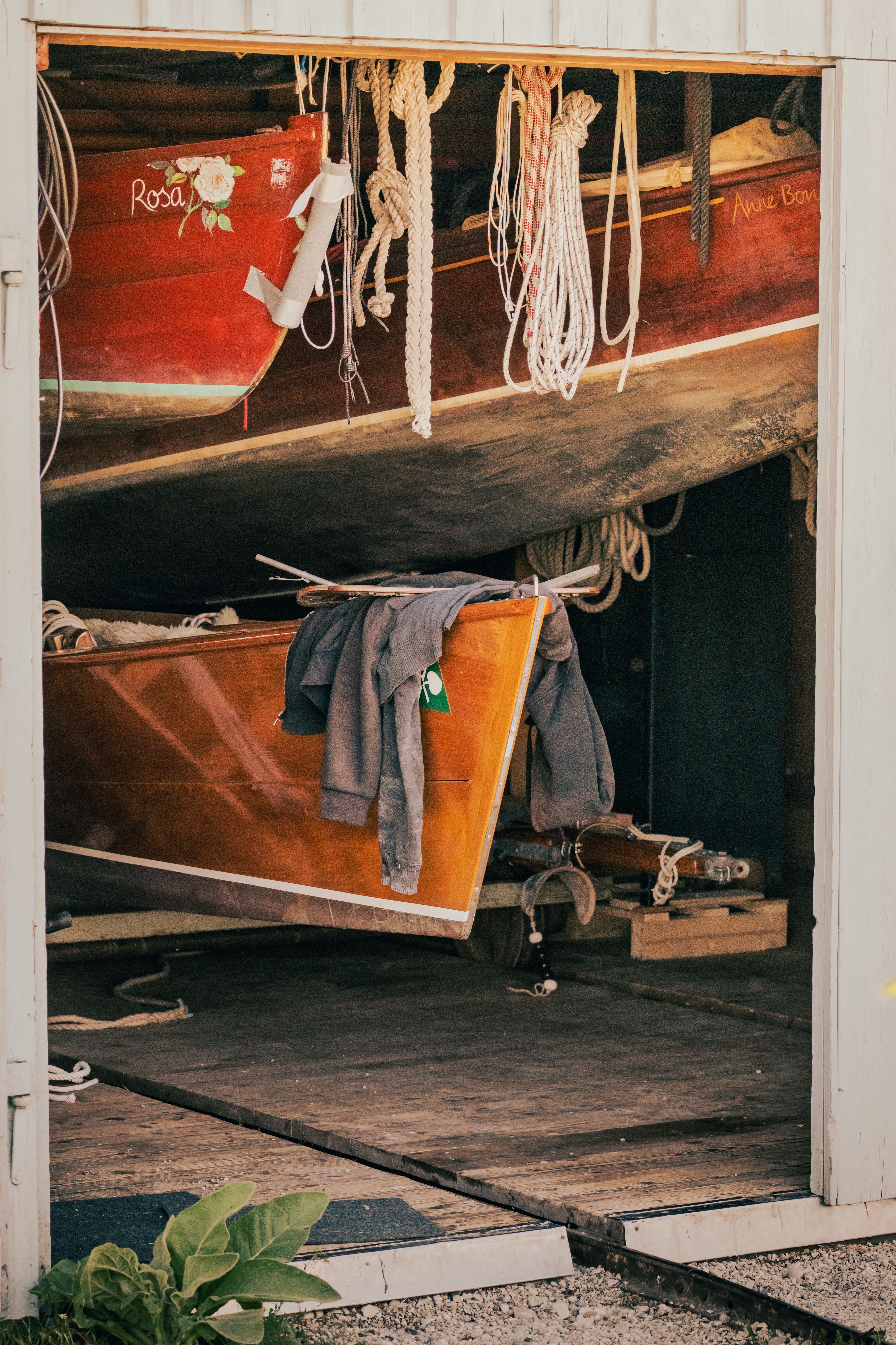 Vintage Wooden Boats in Storage Shed · Free Stock Photo