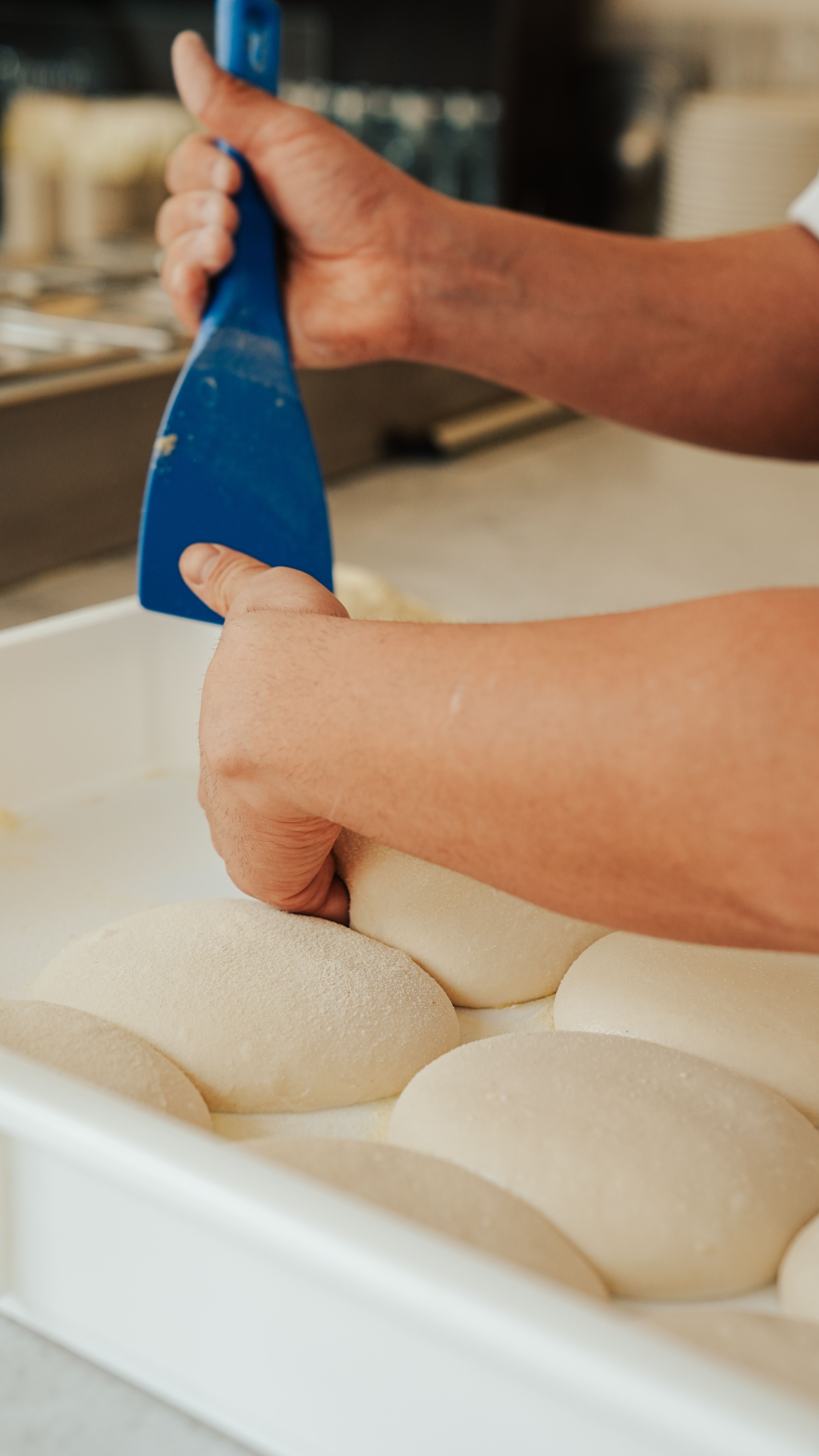 Artisan Baking: Dividing Dough in Kitchen · Free Stock Photo