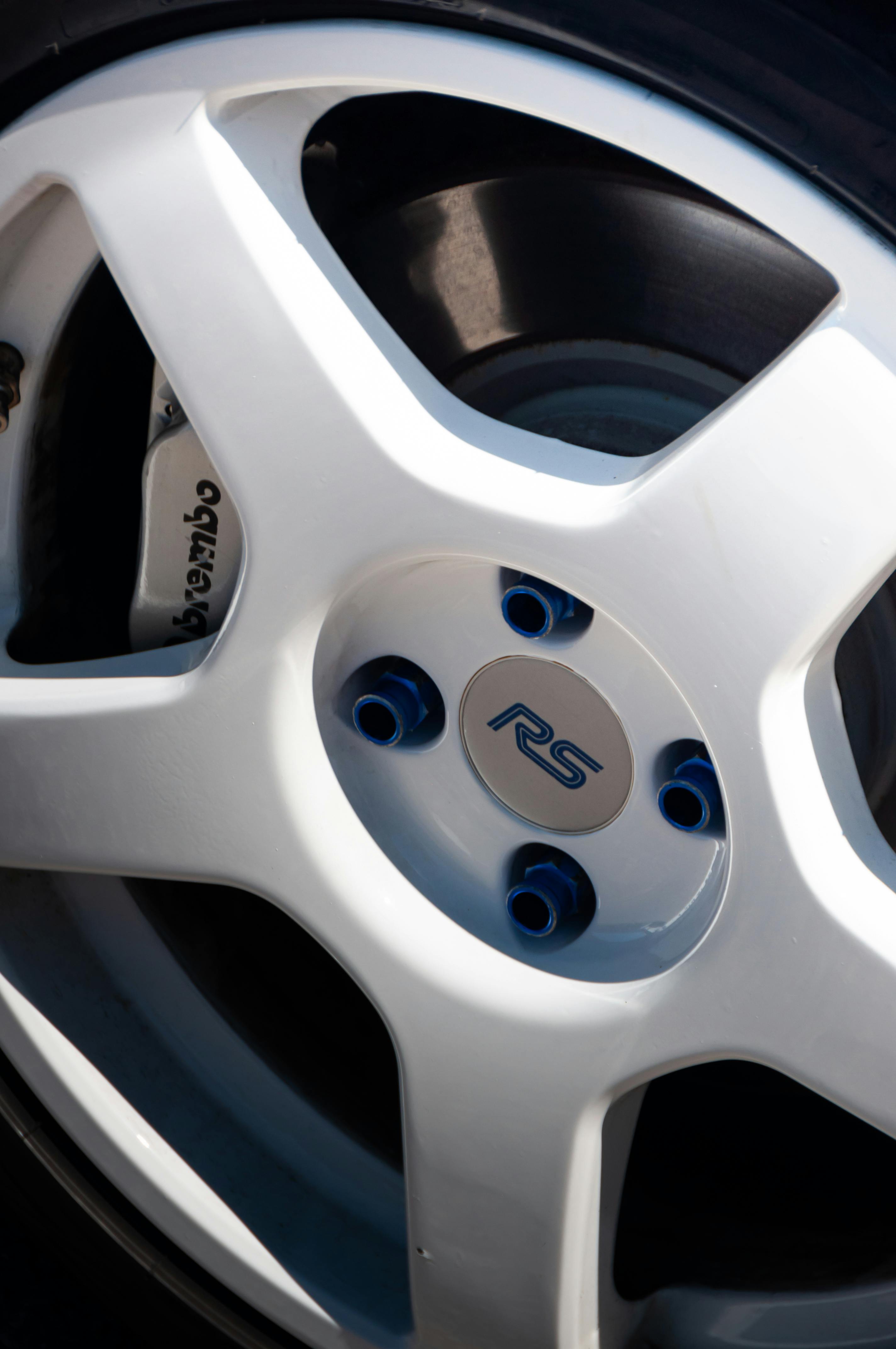 Closeup of Sports Car Wheel with RS Badge · Free Stock Photo