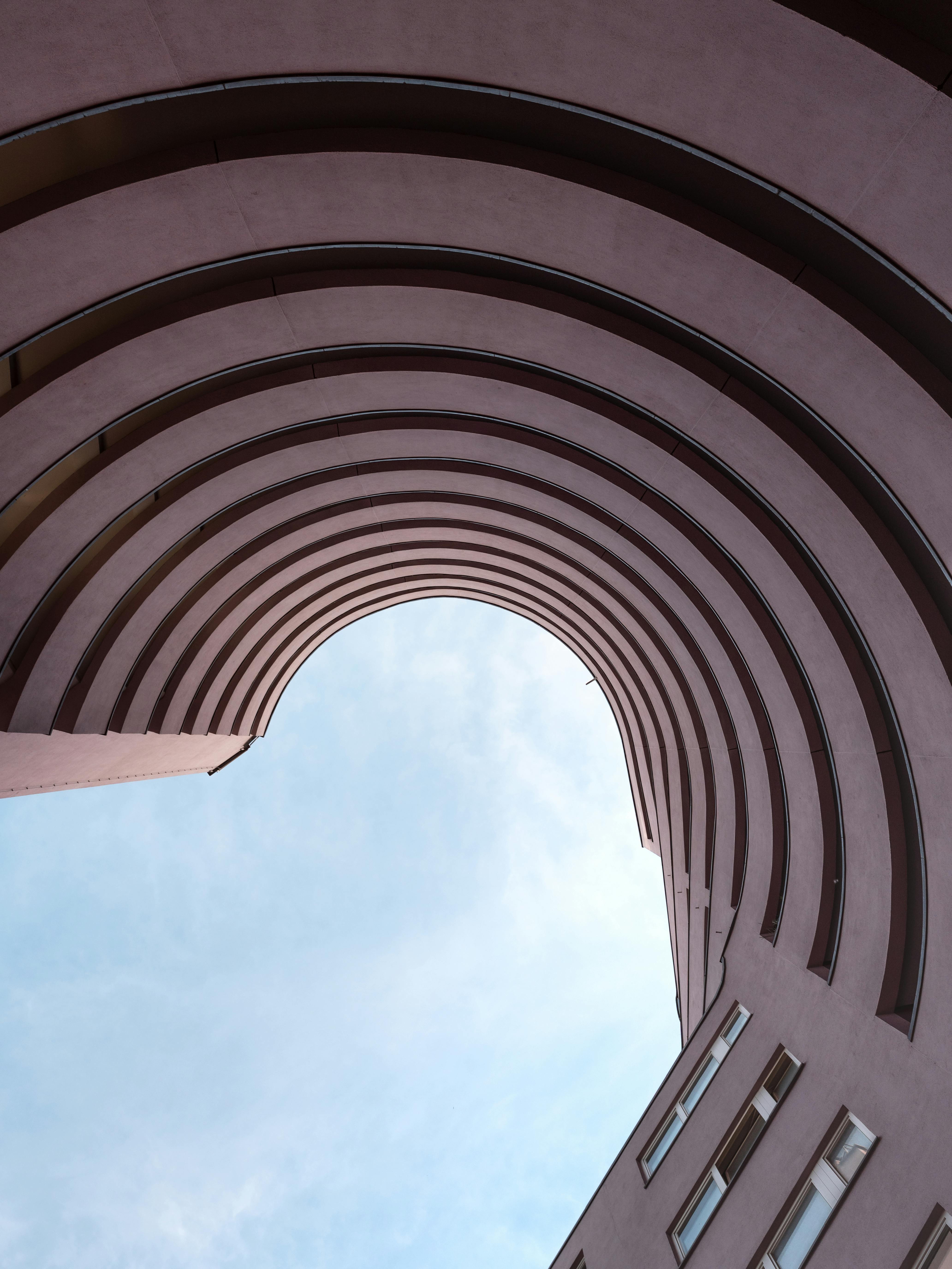 Curved Architectural Design with Blue Sky View · Free Stock Photo