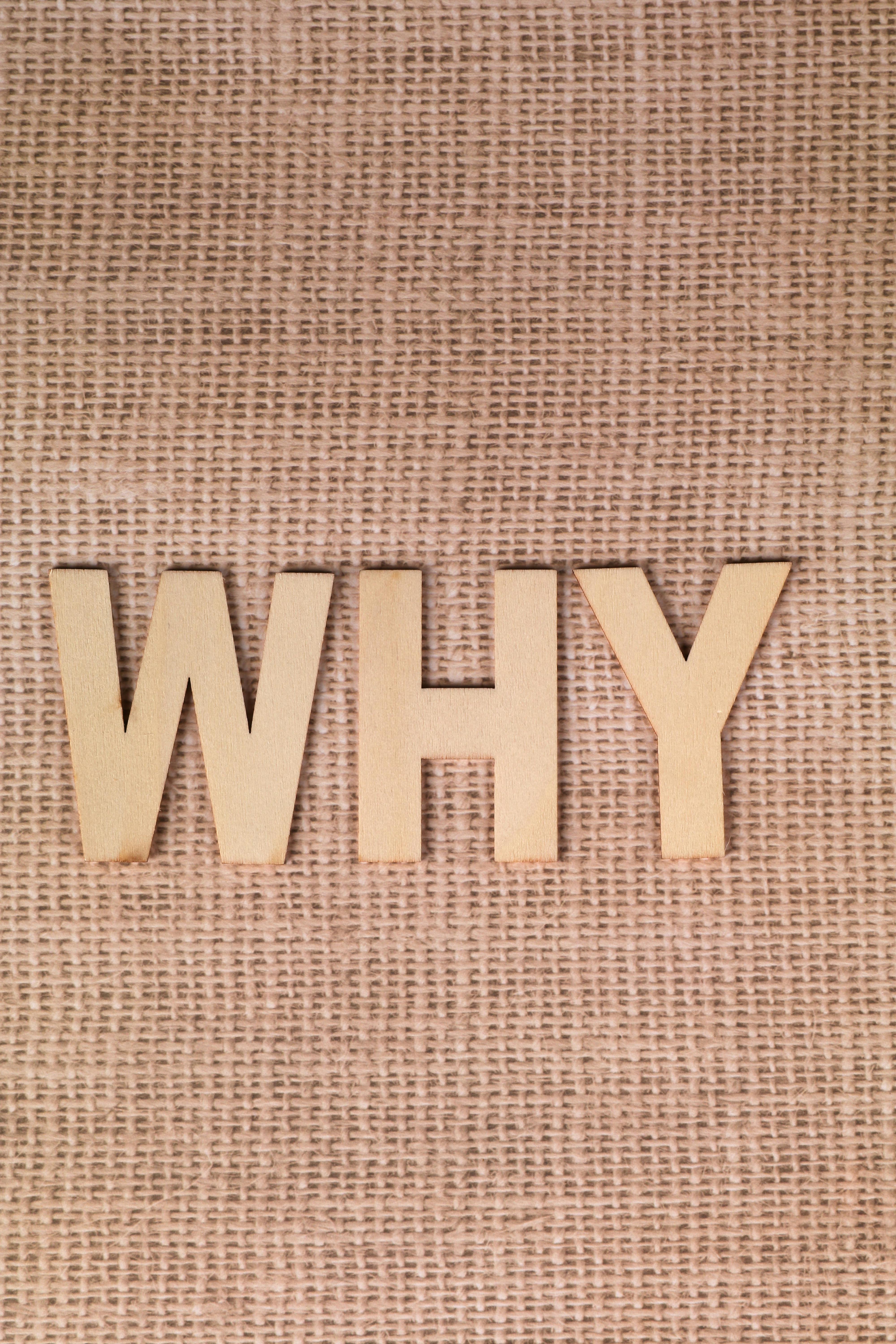 Wooden 'WHY' Letters on Burlap Background · Free Stock Photo