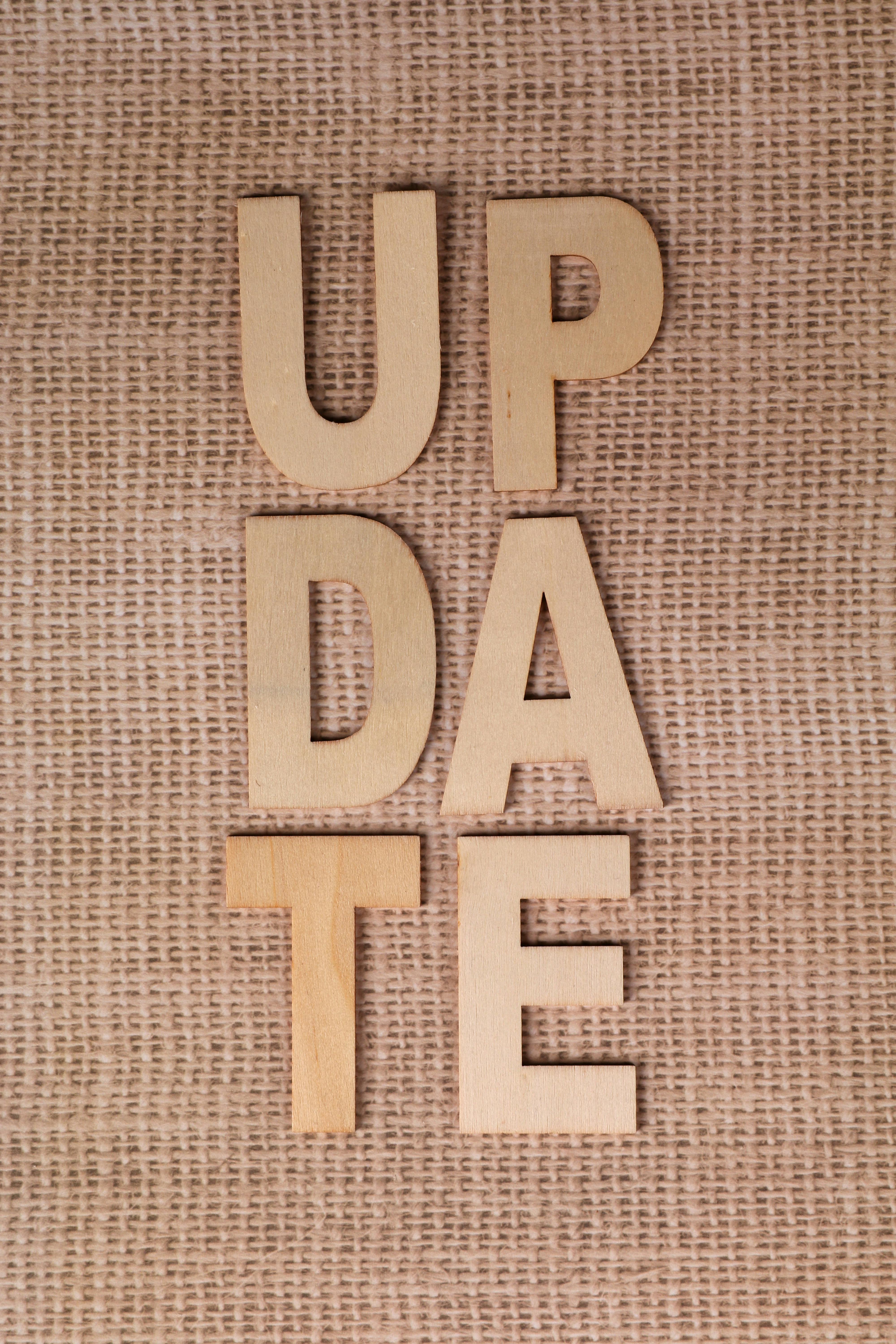 Update Lettering Text on Black Background · Free Stock Photo