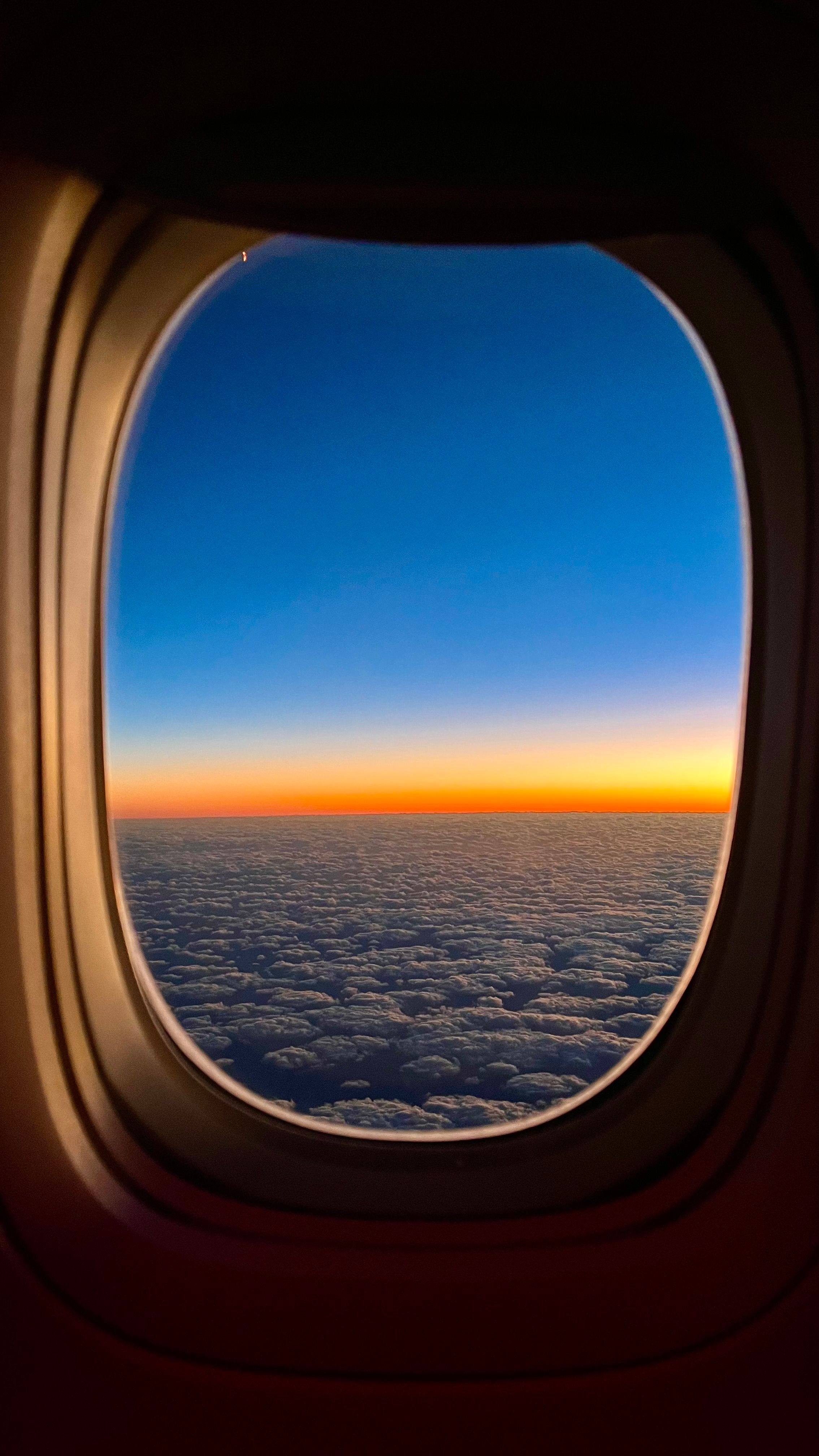 Persons Hand near Airplane Window · Free Stock Photo