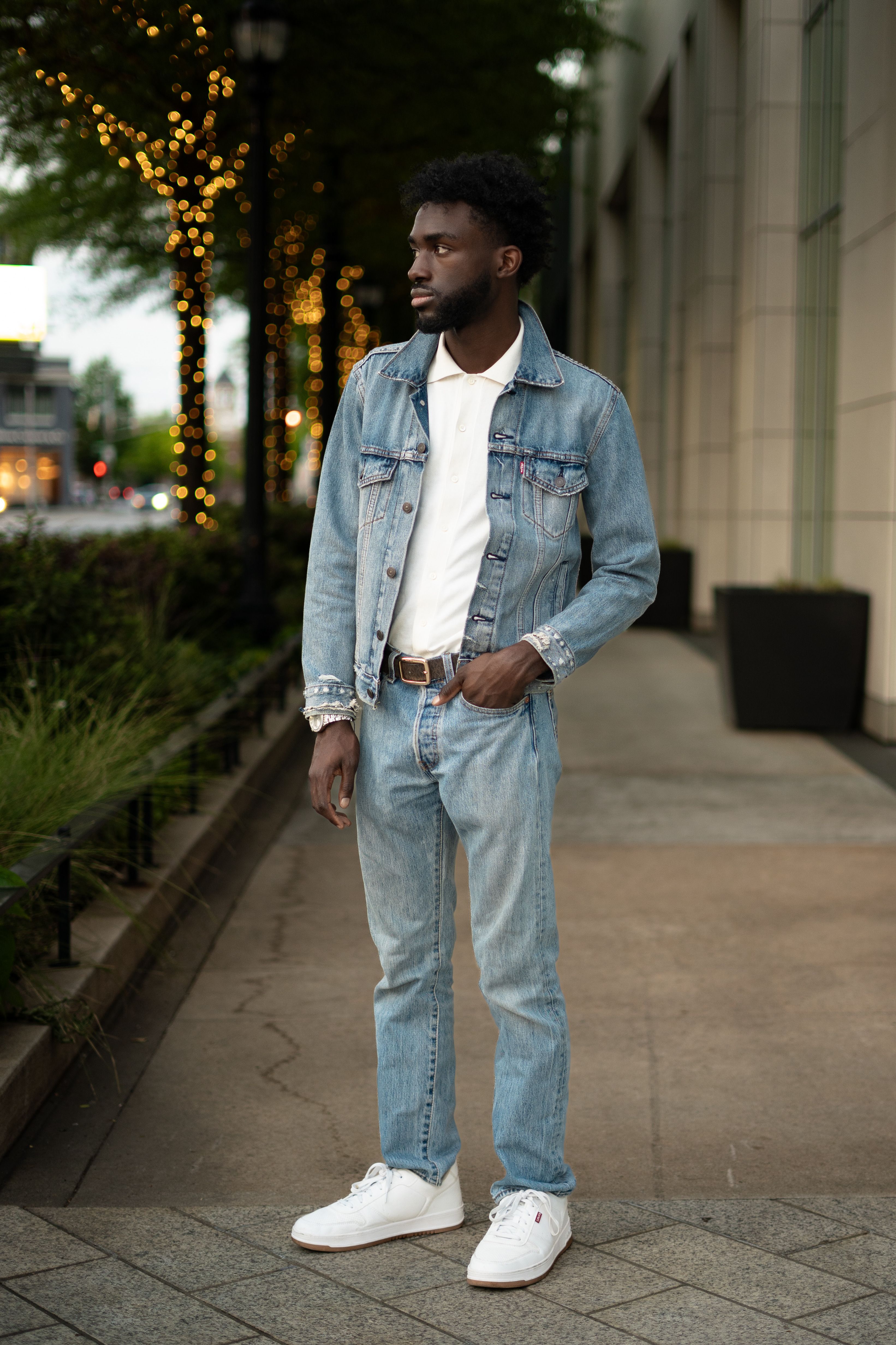 Stylish Man in Denim Outfit Stands Confidently Outdoors · Free Stock Photo