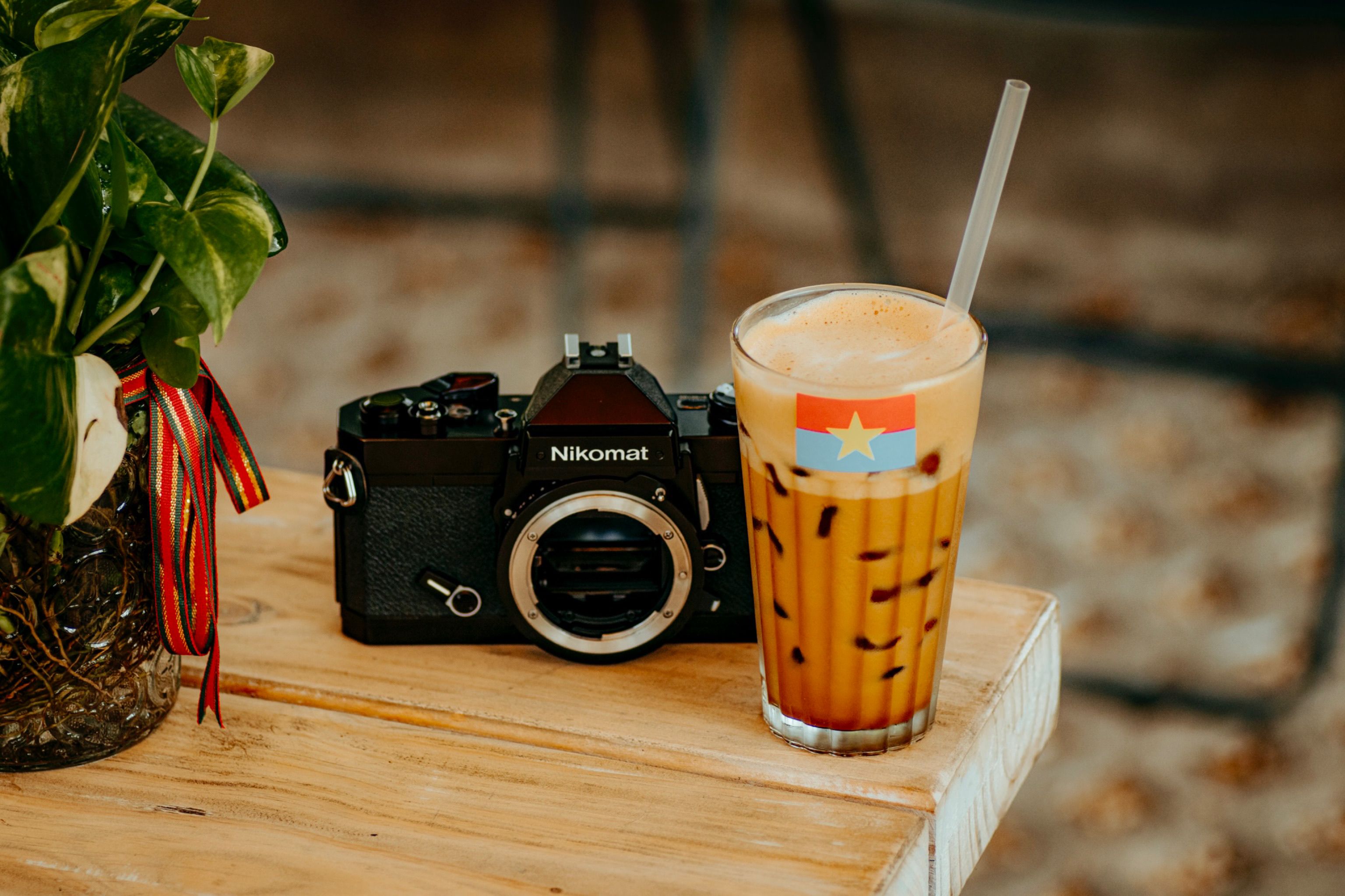 Vintage Camera and Iced Coffee on Wooden Table · Free Stock Photo