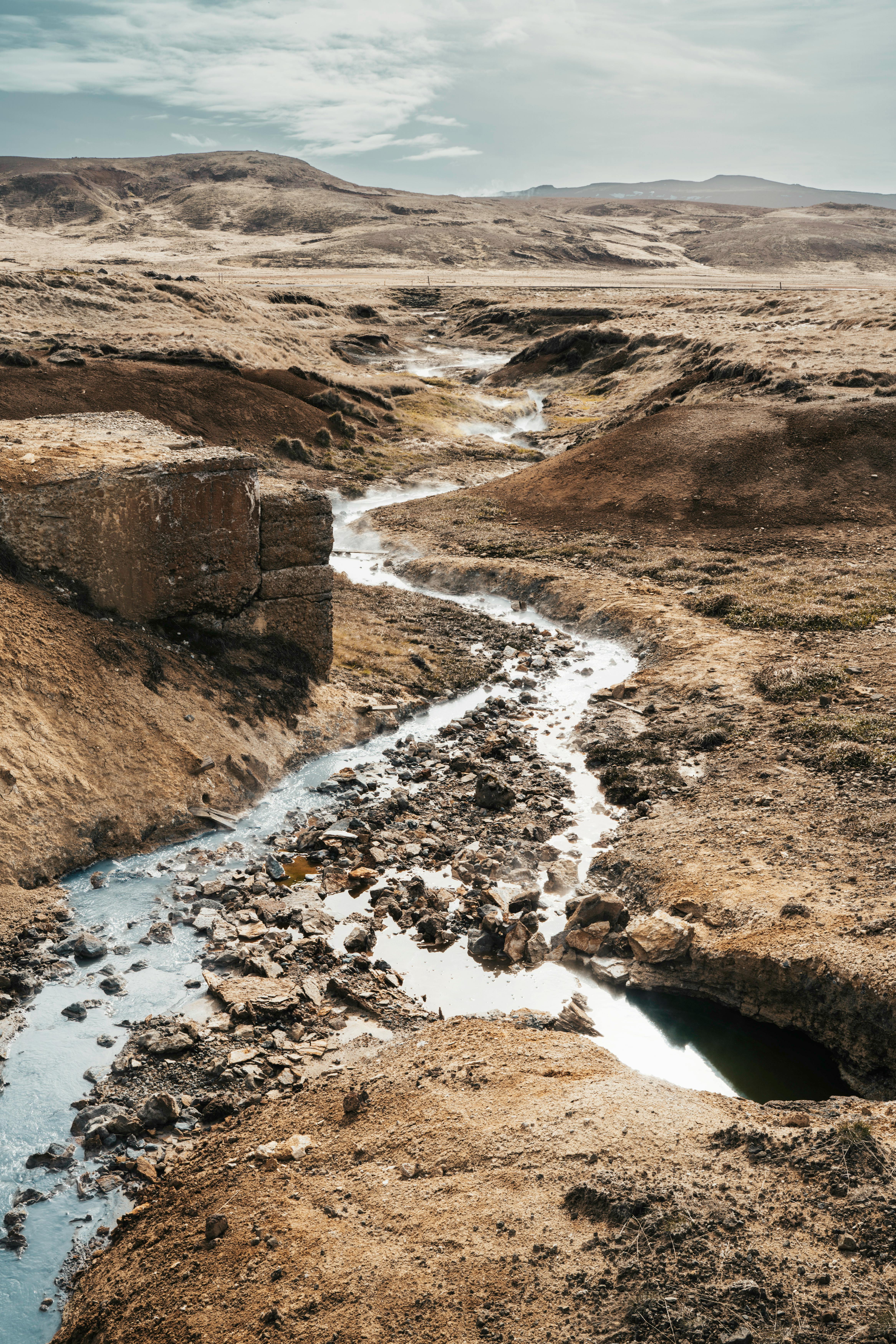 Body of Water Between Mountains · Free Stock Photo