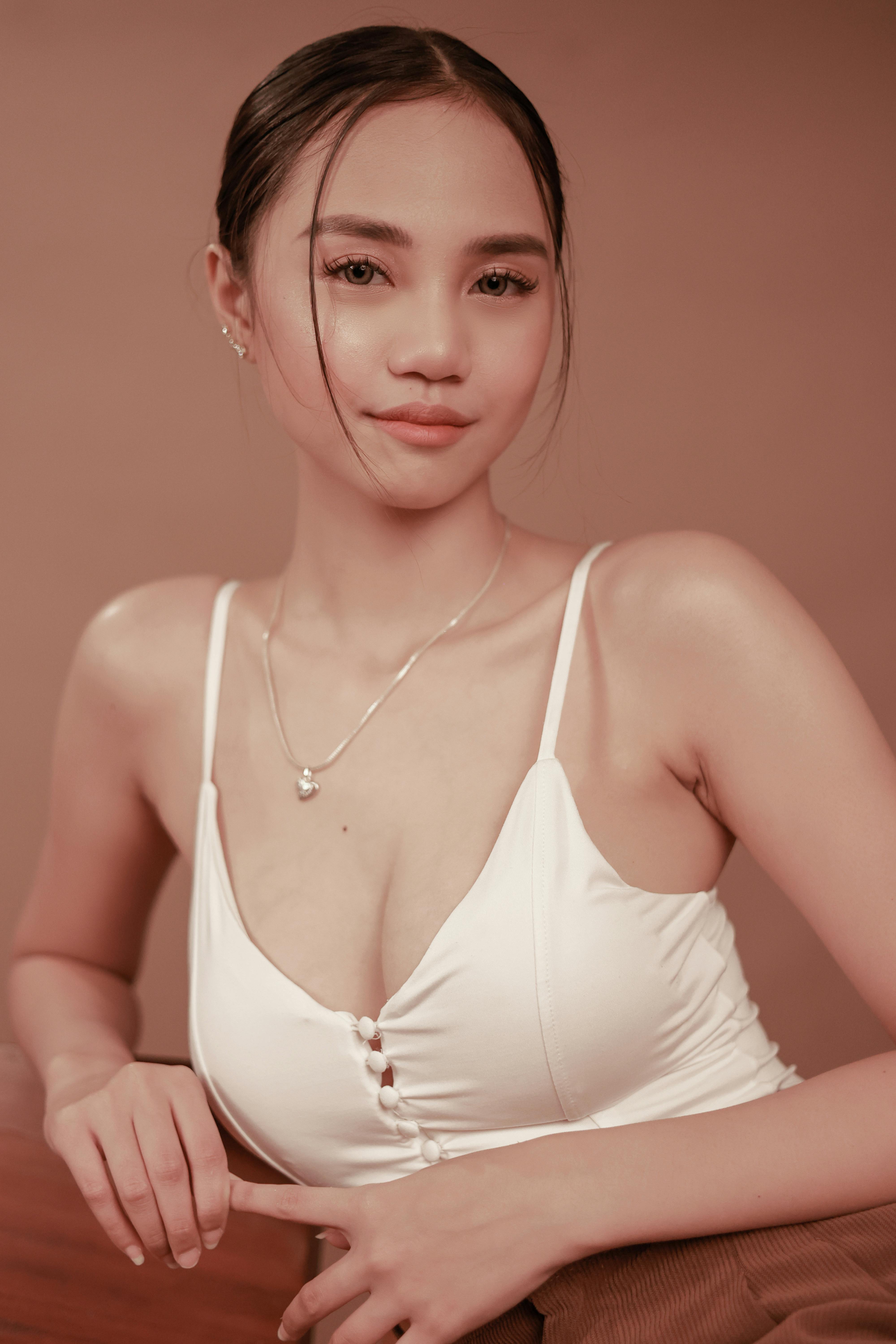 Elegant Portrait of a Young Woman in Stylish Attire · Free Stock Photo