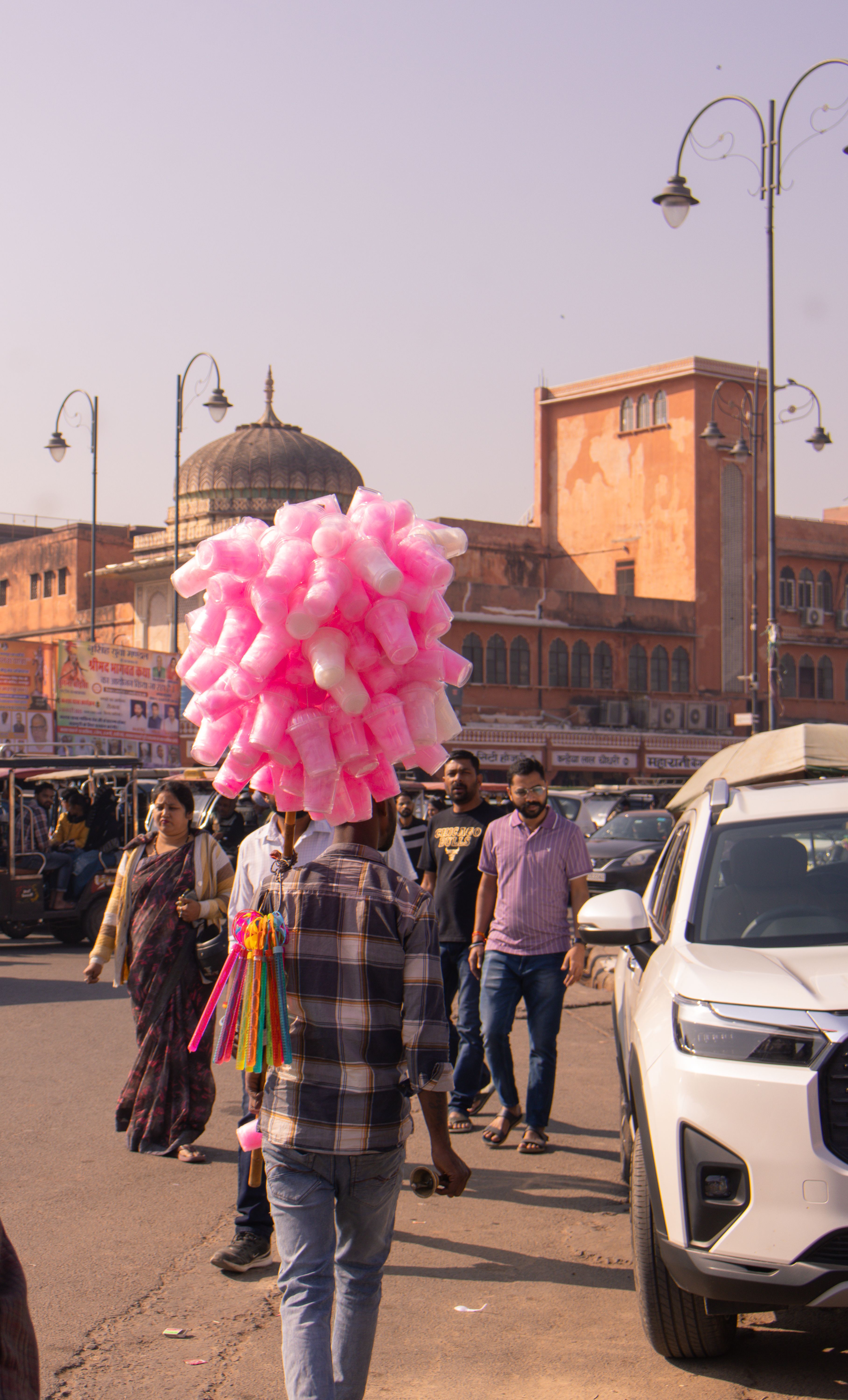 Street Vendor Selling Pink Cotton Candy in Bustling Market · Free Stock ...