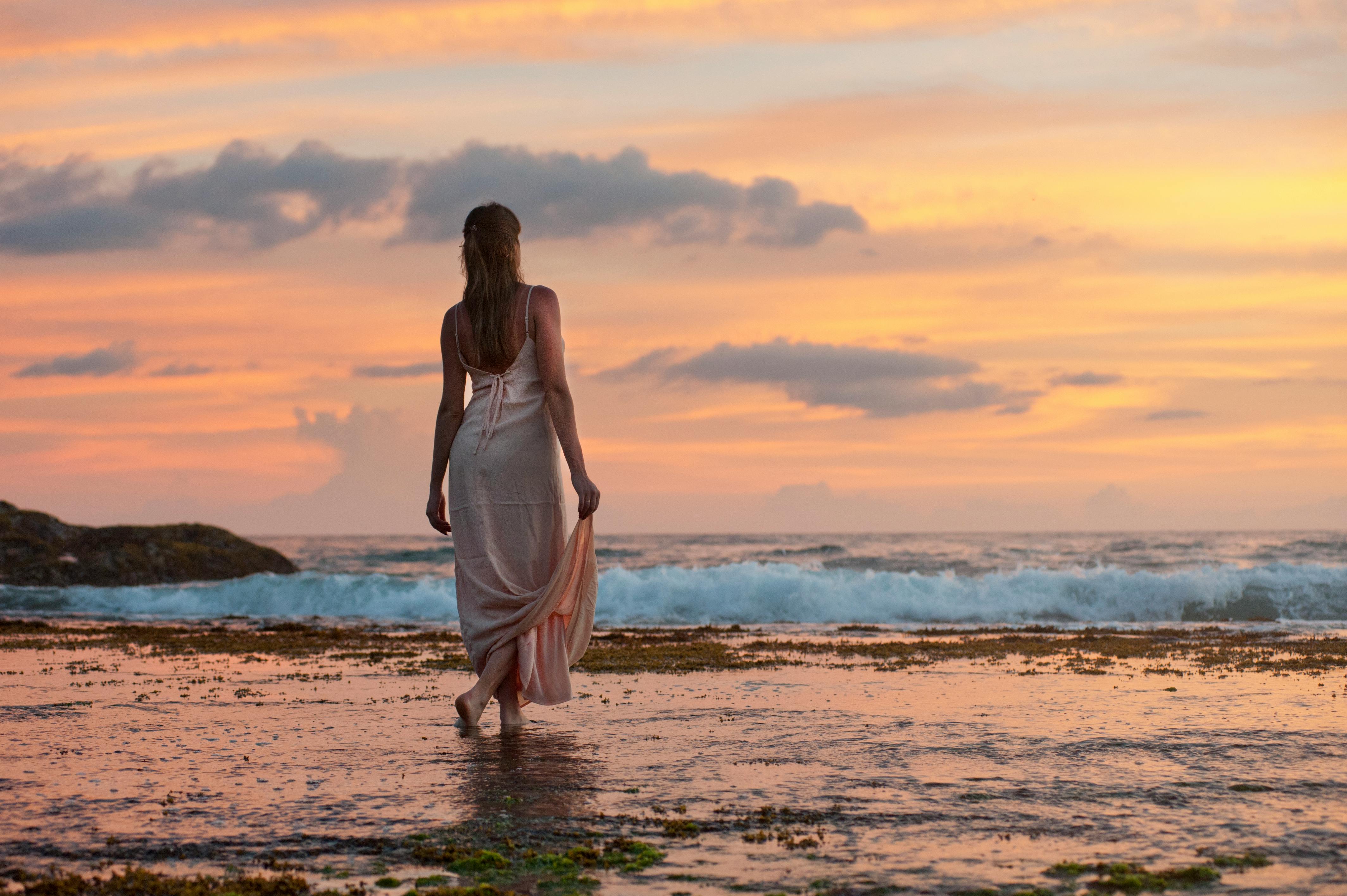 Woman Lying on Rock Against Sky · Free Stock Photo