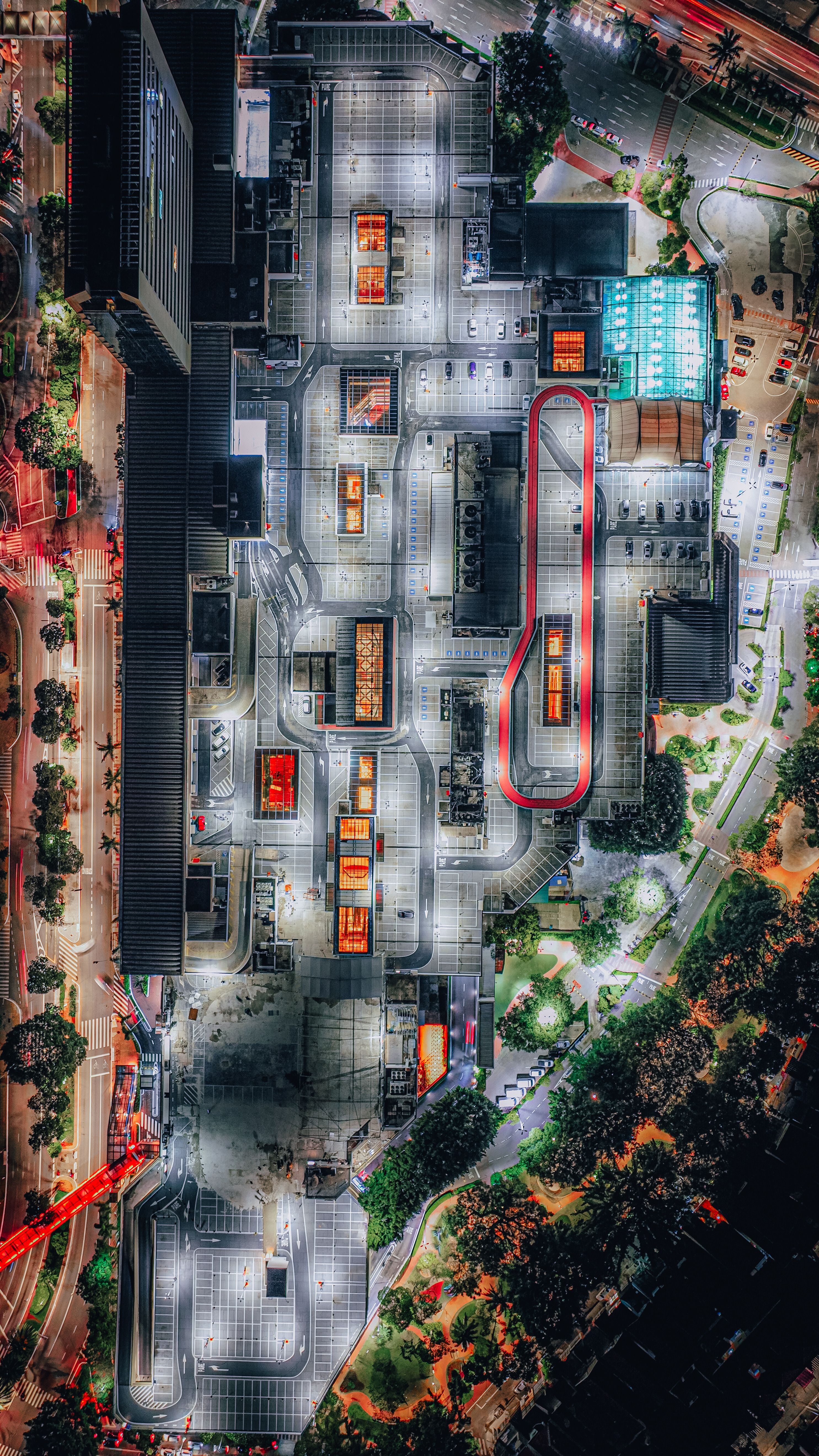Aerial View of Illuminated Urban Parking Structure · Free Stock Photo