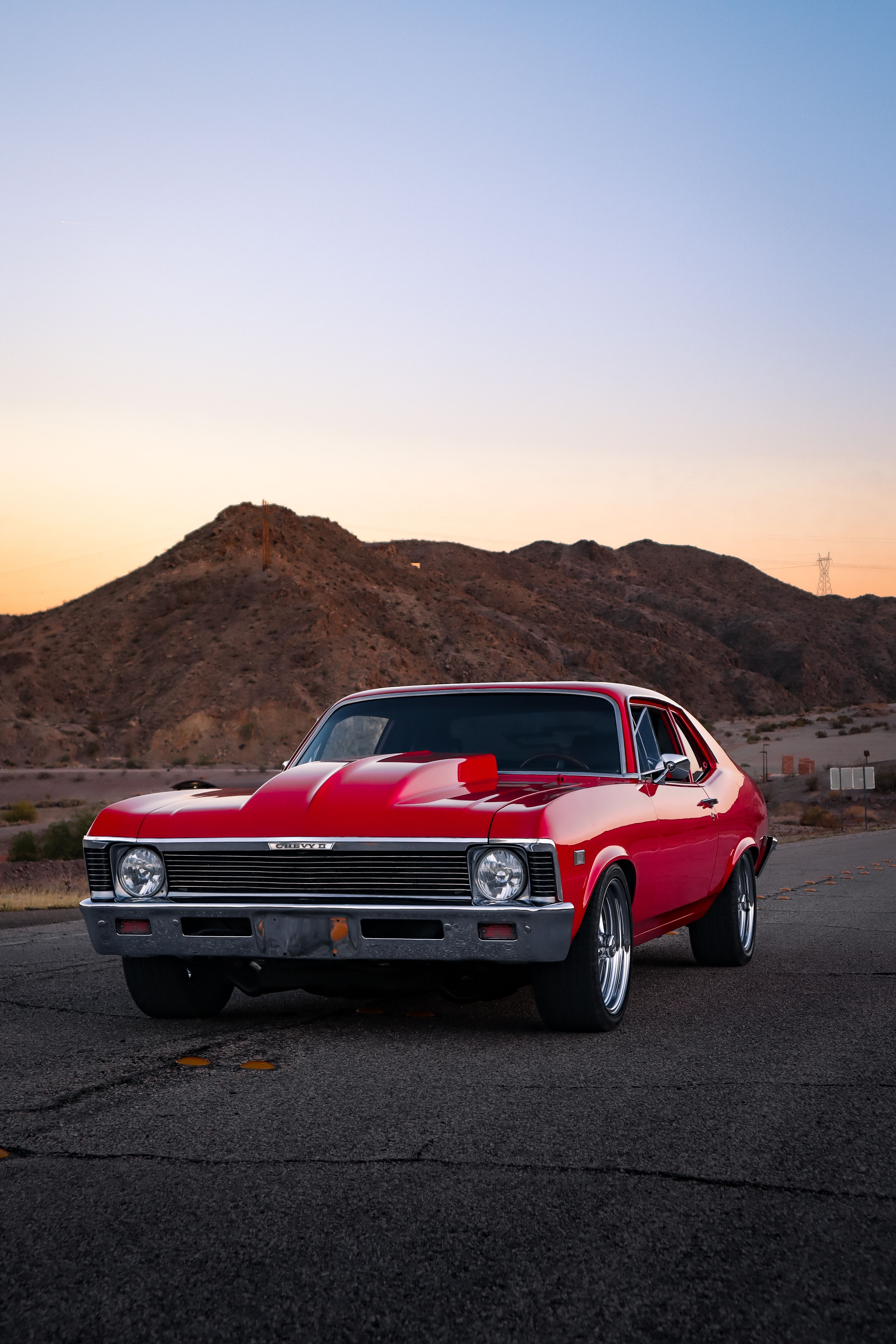 Classic Red Muscle Car on Deserted Road at Sunset · Free Stock Photo