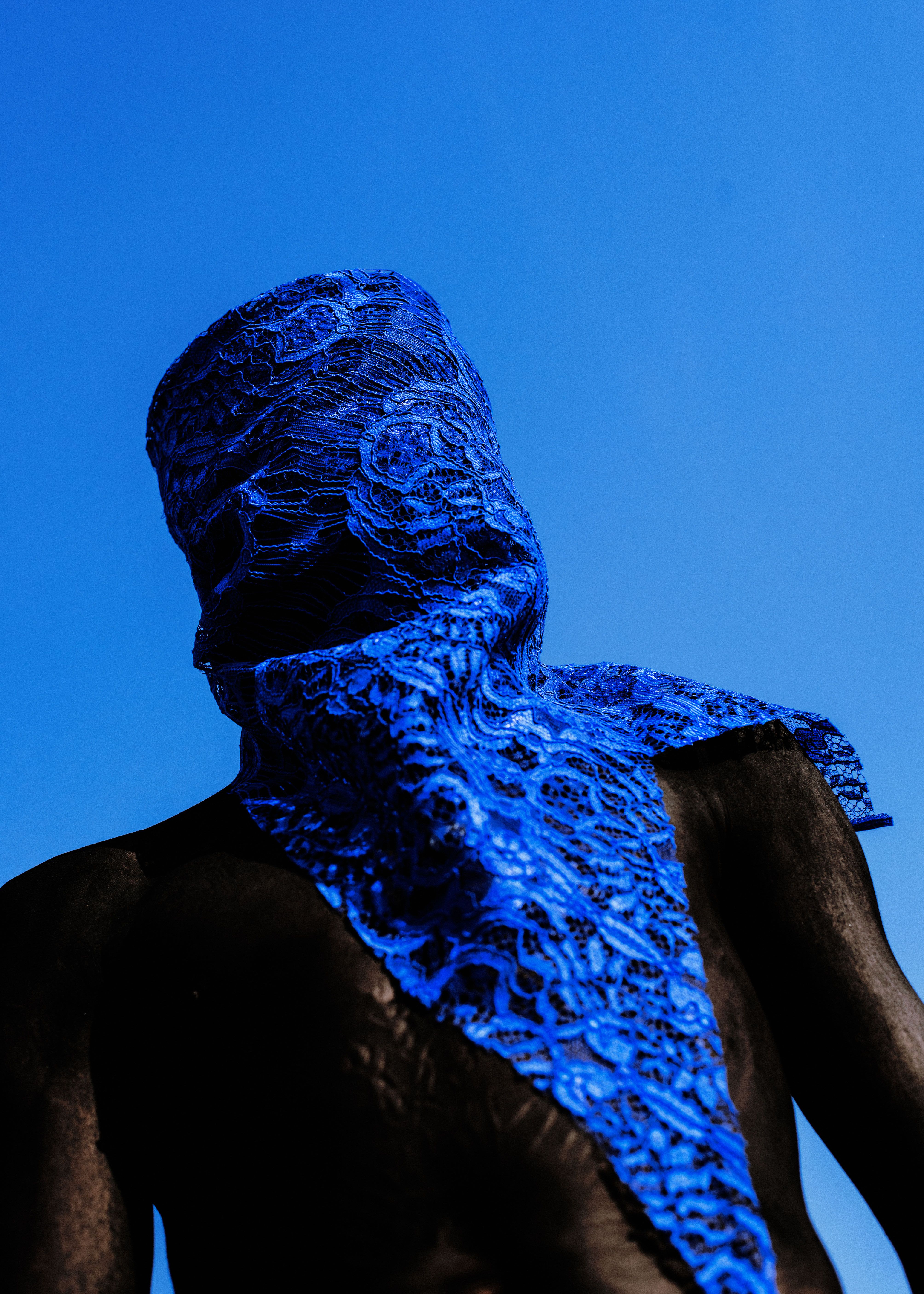 Artistic Portrait of a Figure with Blue Lace · Free Stock Photo