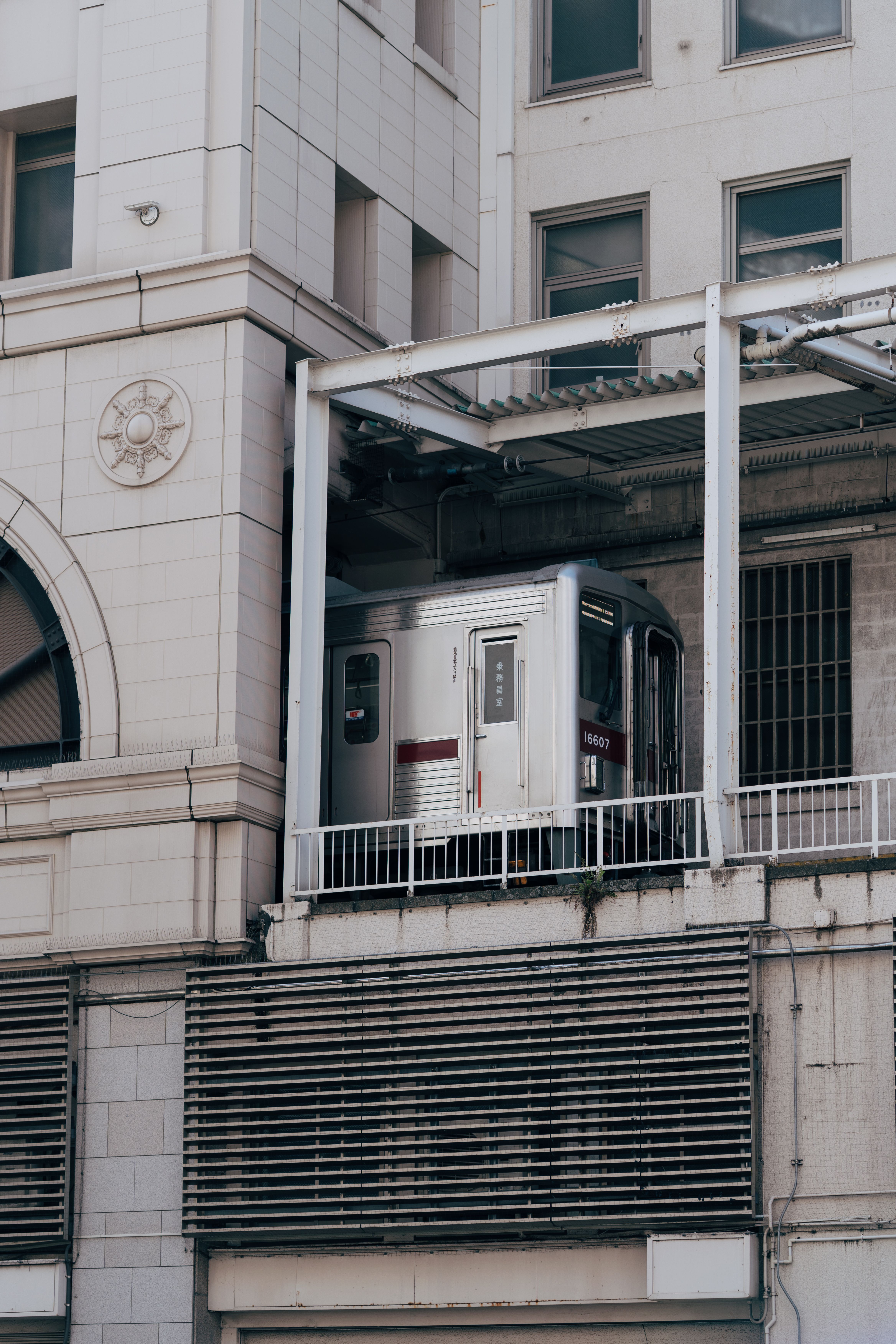 Tokyo Subway Train Passing Urban Architecture · Free Stock Photo