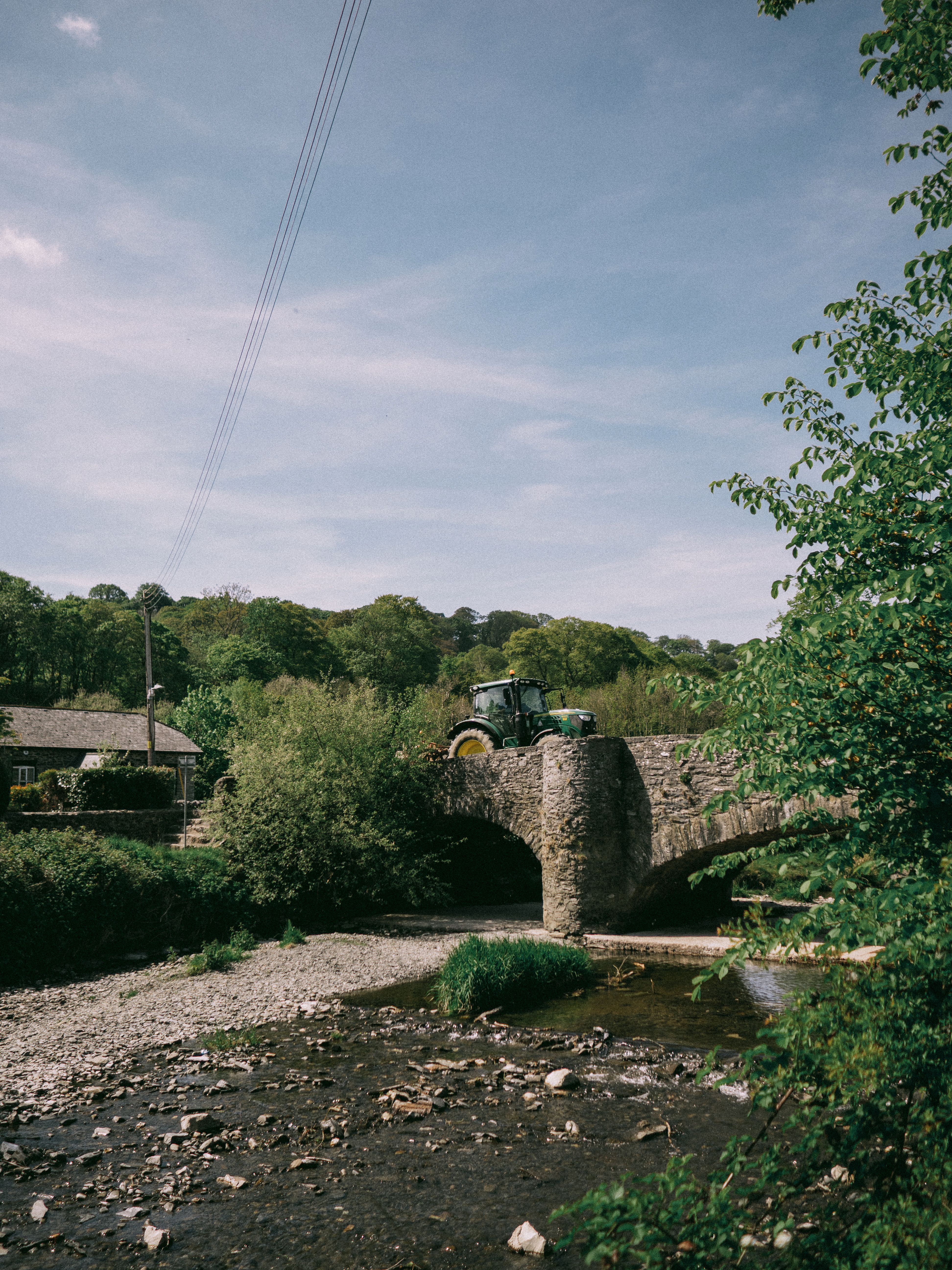 Tractor Crossing Stone Bridge in Llanfair Talhaiarn · Free Stock Photo
