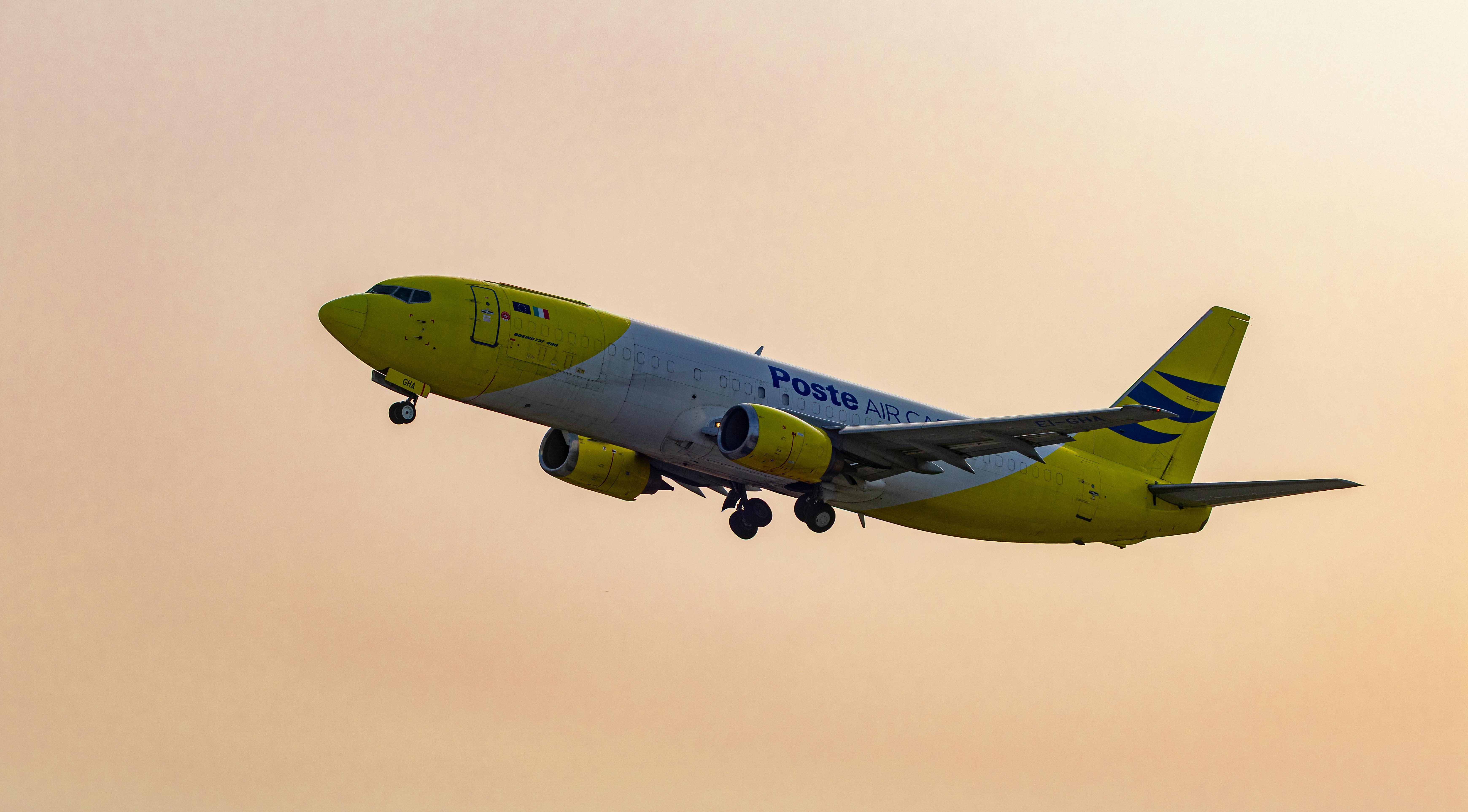 Yellow Cargo Plane Taking Off at Sunset · Free Stock Photo
